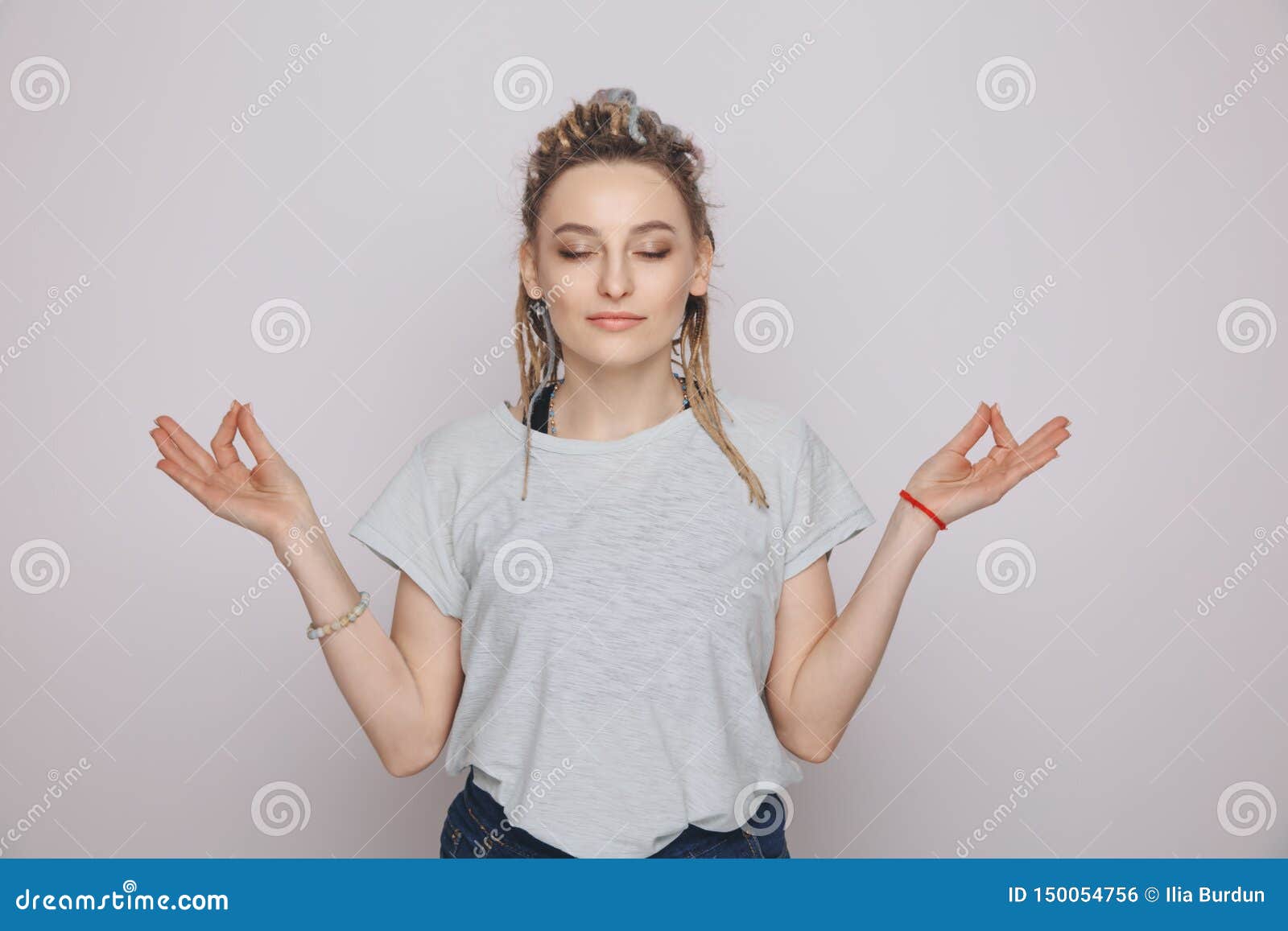 Young Woman in a Zen Pose in a Studio. Stock Photo - Image of model ...