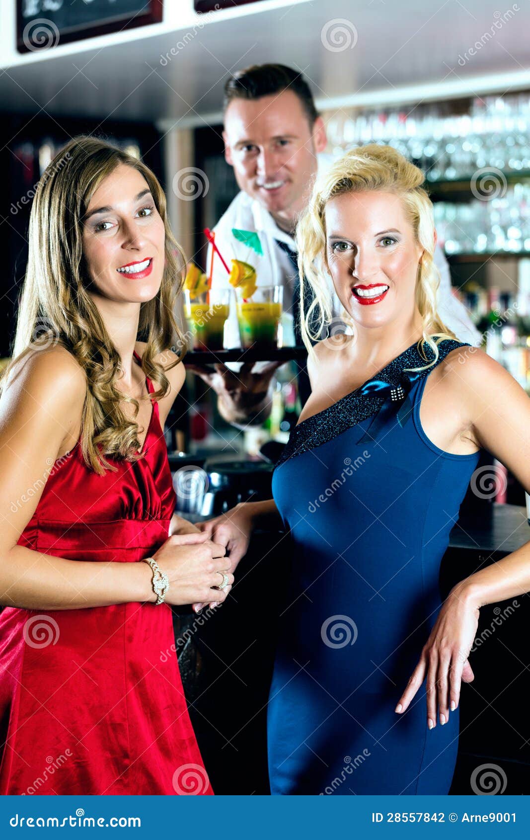 Young Women and Bartender in Club or Bar Stock Photo - Image of ...
