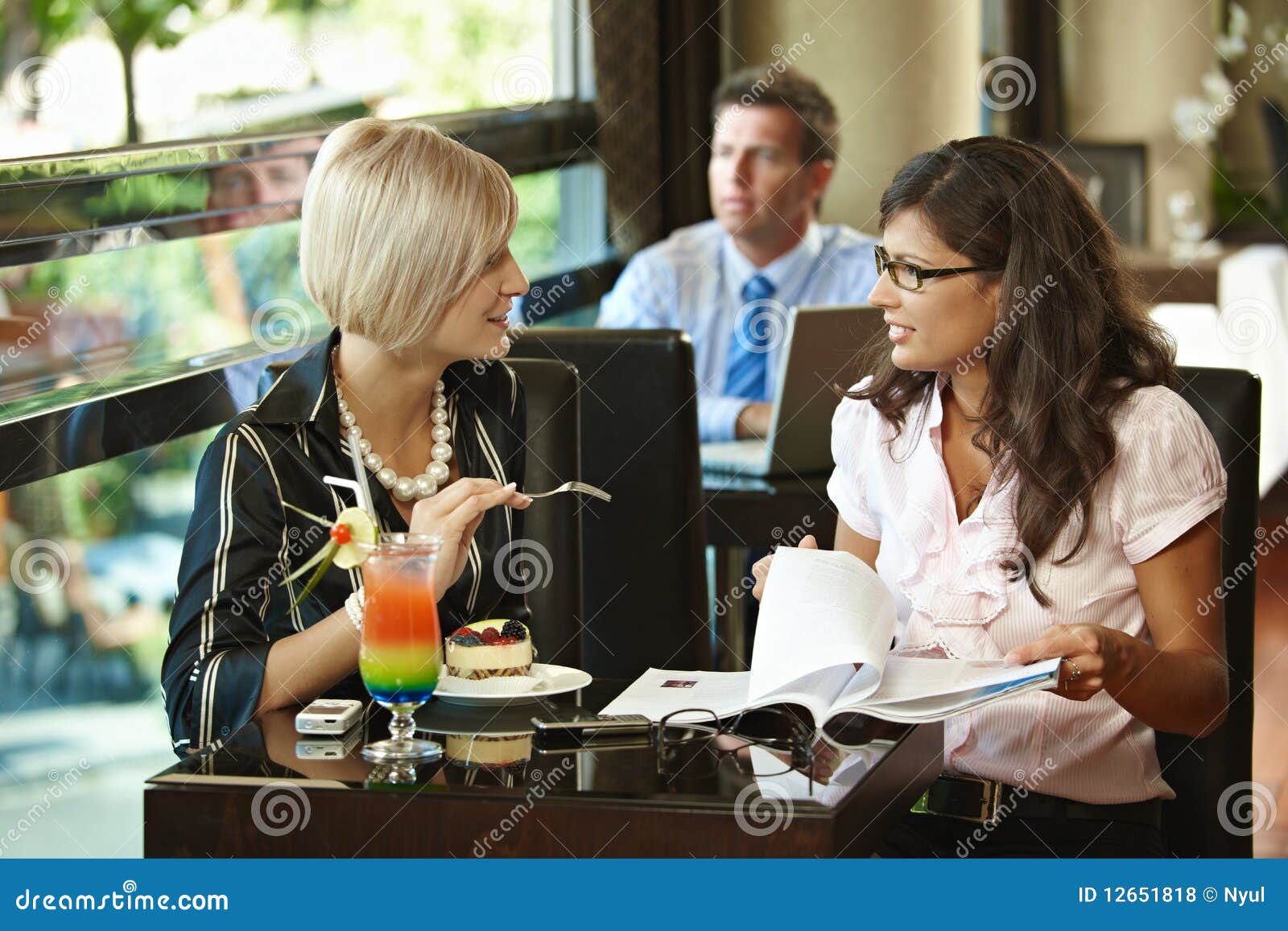 Young women in cafe stock photo. Image of expression - 12651818