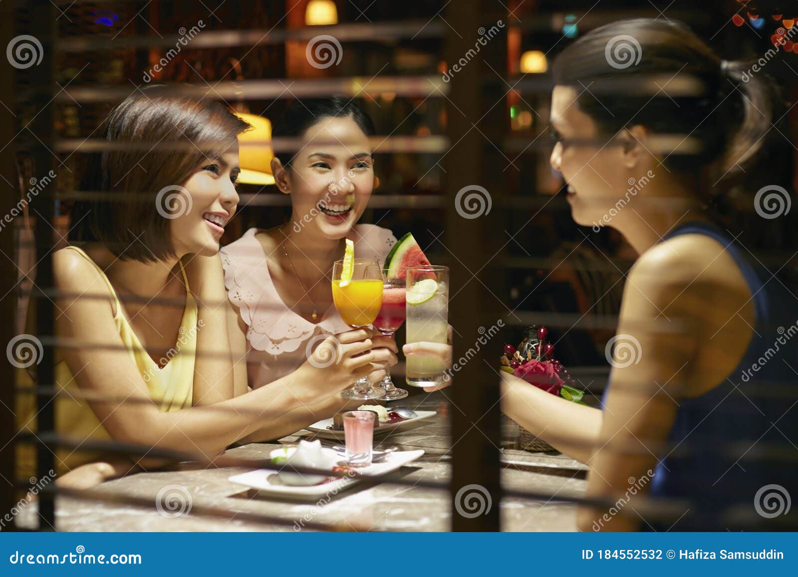 Young Women Cheers Their Drinks Stock Photo - Image of friends, night ...