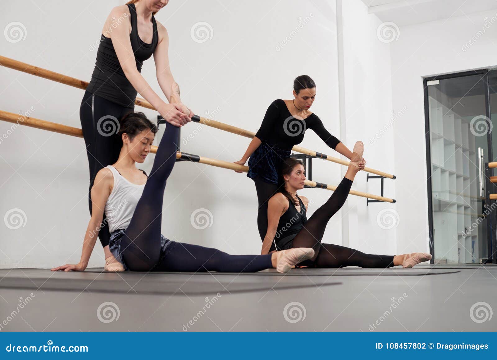 Stretching in pairs stock photo. Image of class, ballet - 108457802