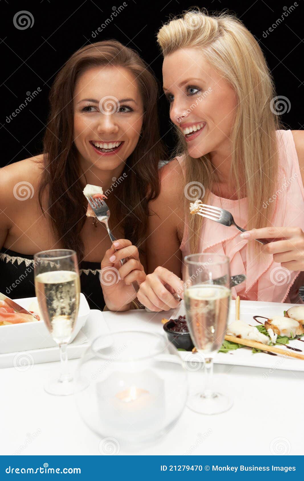 Young Women Eating in Restaurant Stock Photo - Image of celebrating ...