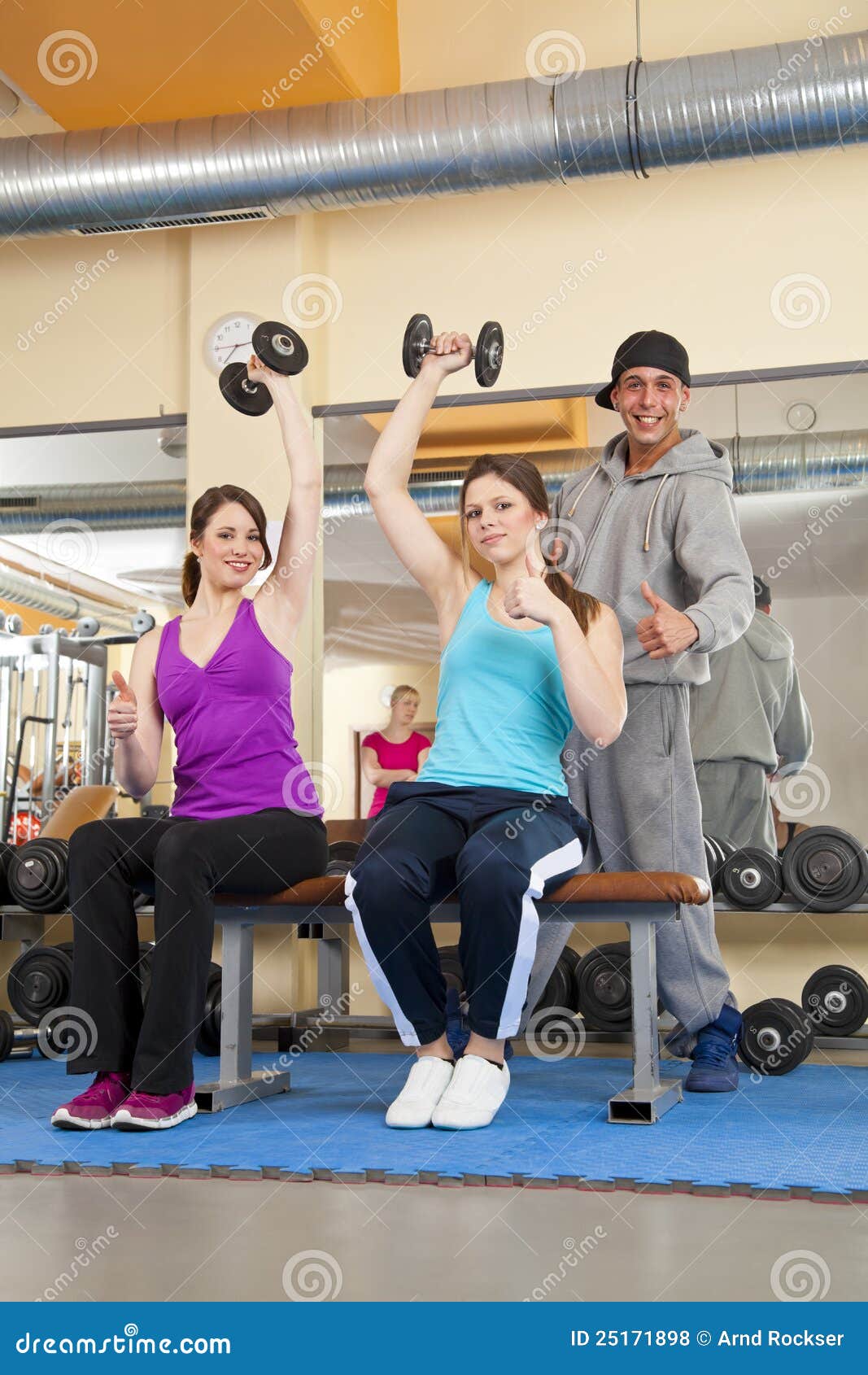 Young Women Exercising in Gym with Trainer Stock Photo - Image of ...
