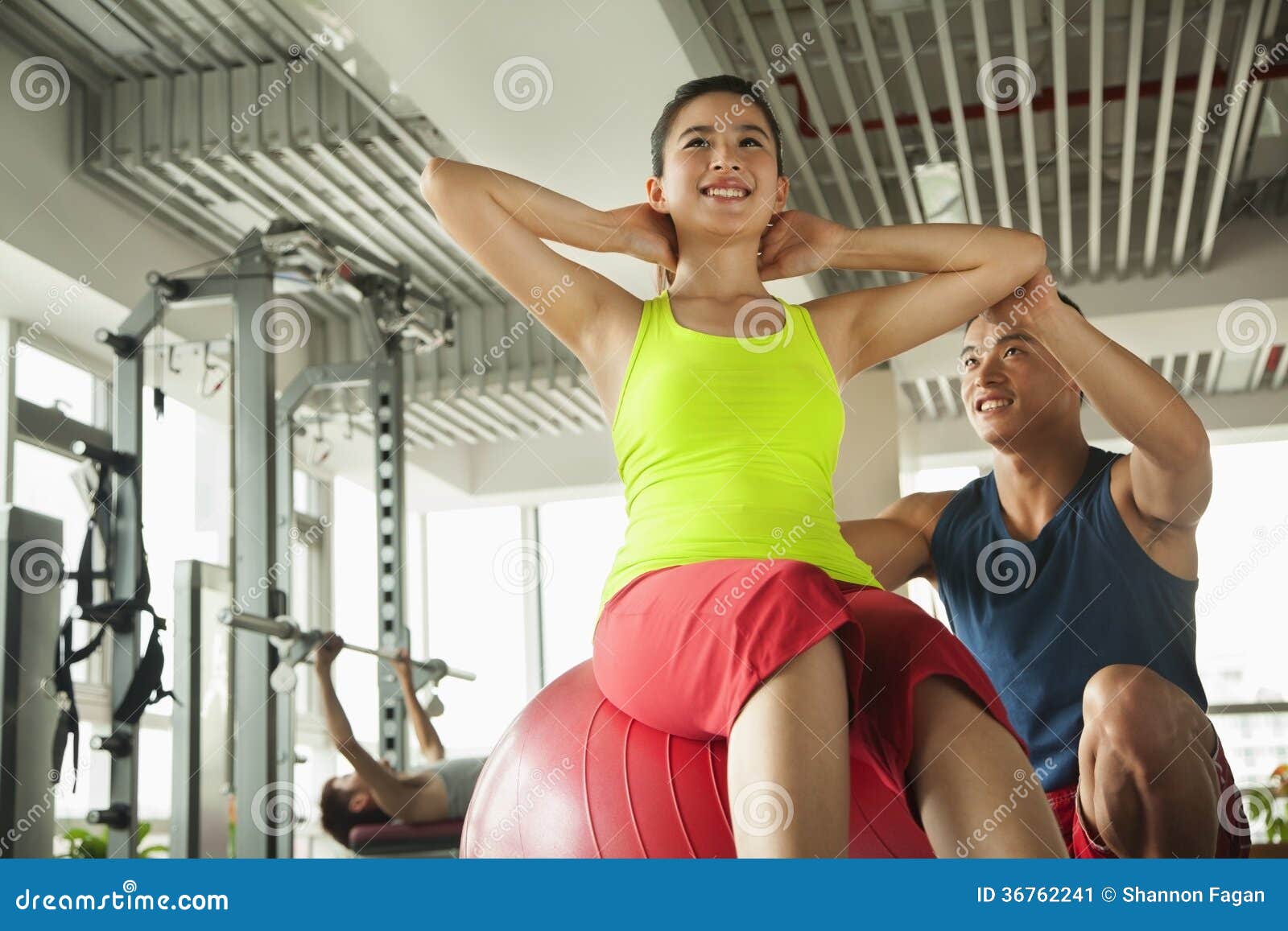 Young Women Exercising with Her Personal Trainer in the Gym Stock Image ...