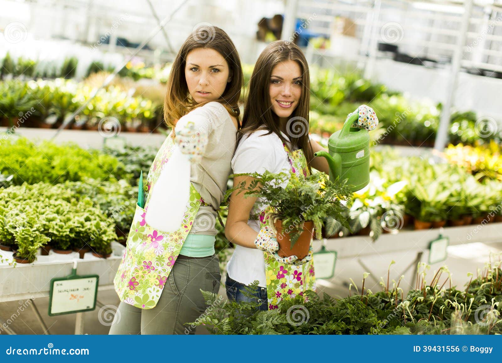 Young Women in Flower Garden Stock Photo - Image of farm, beauty: 39431556