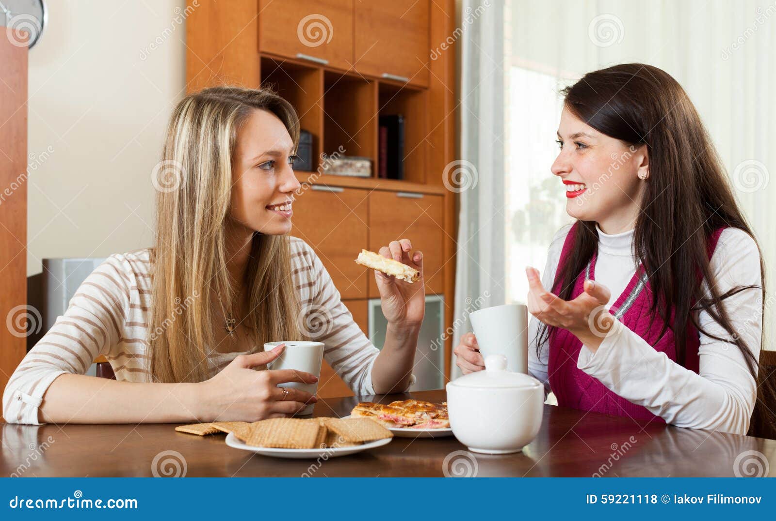 Young Women Gossiping and Drinking Tea Stock Photo - Image of lifestyle ...