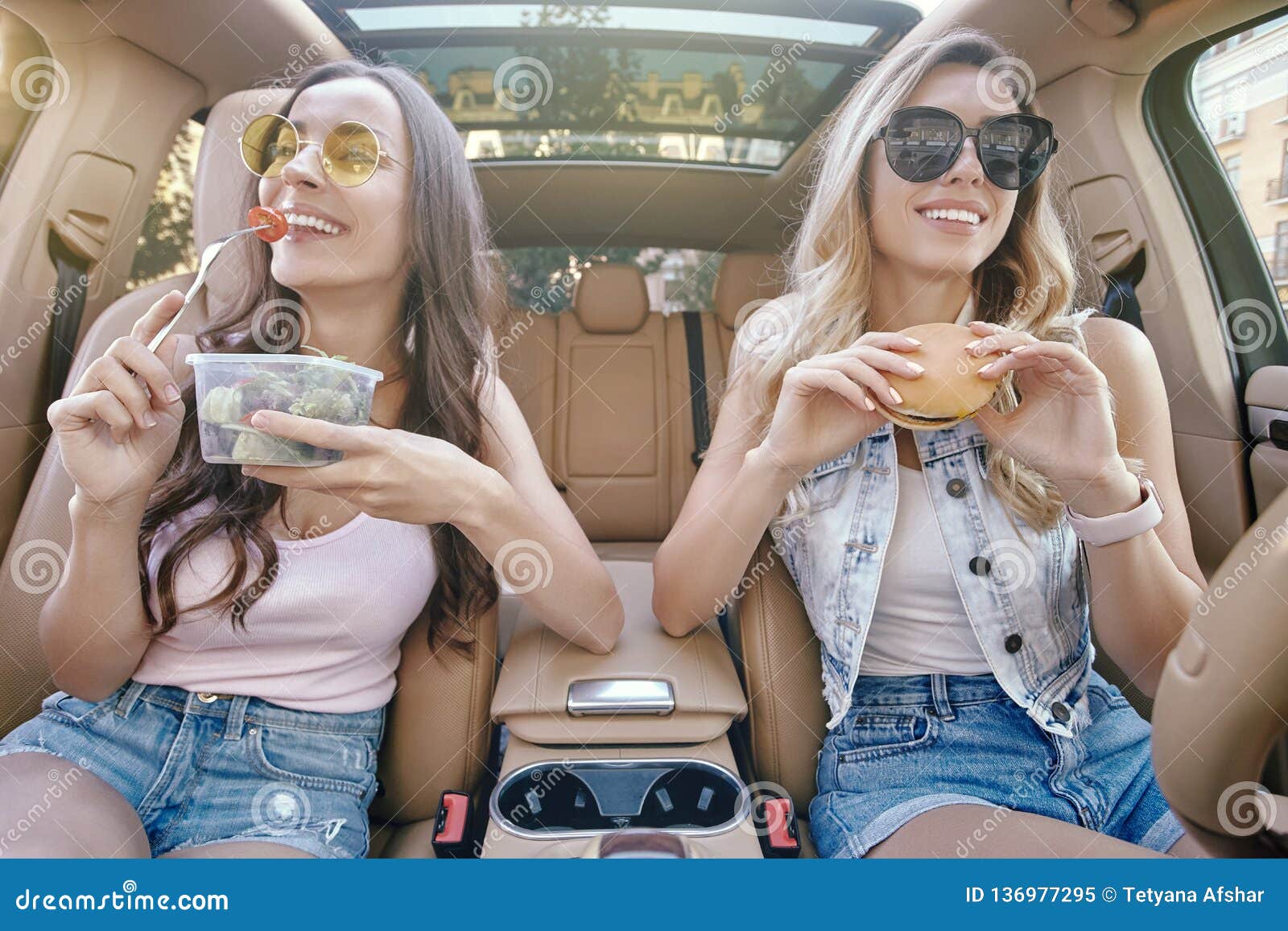 Women Having Lunch in the Car Stock Image - Image of people, brunette ...