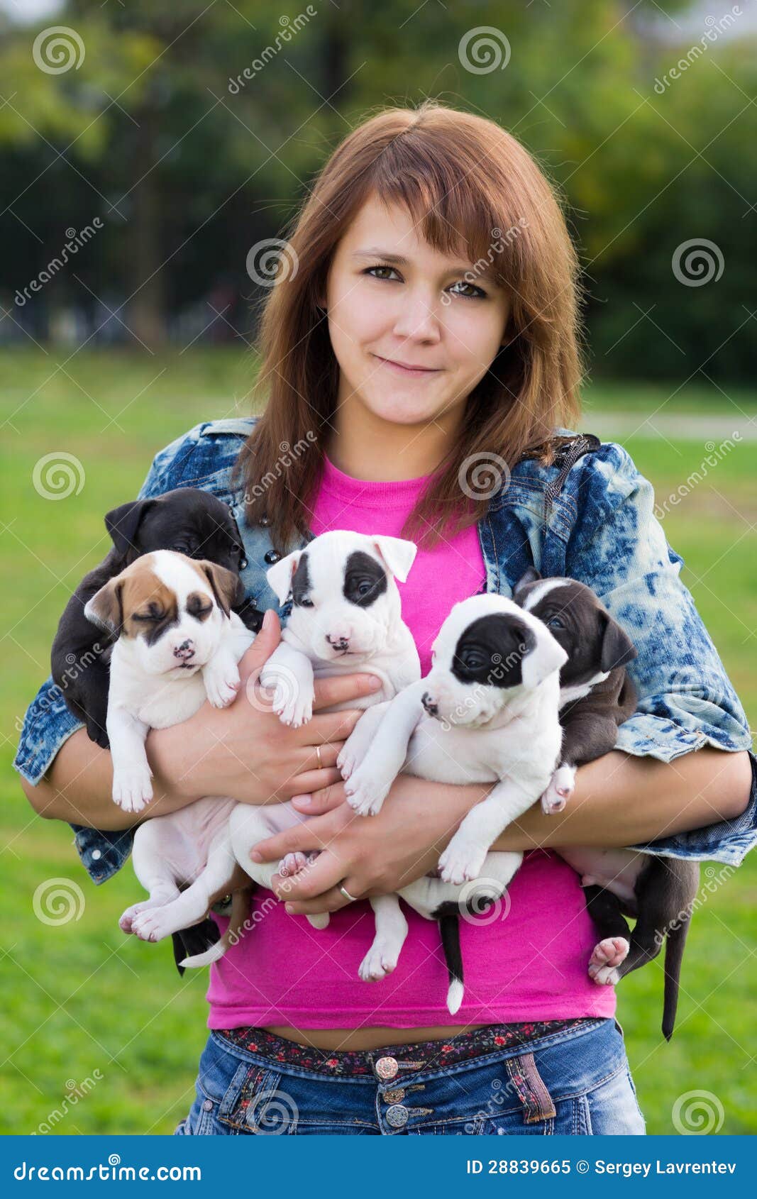 Young Women Holding Five Small Puppies Stock Image - Image of outdoors ...