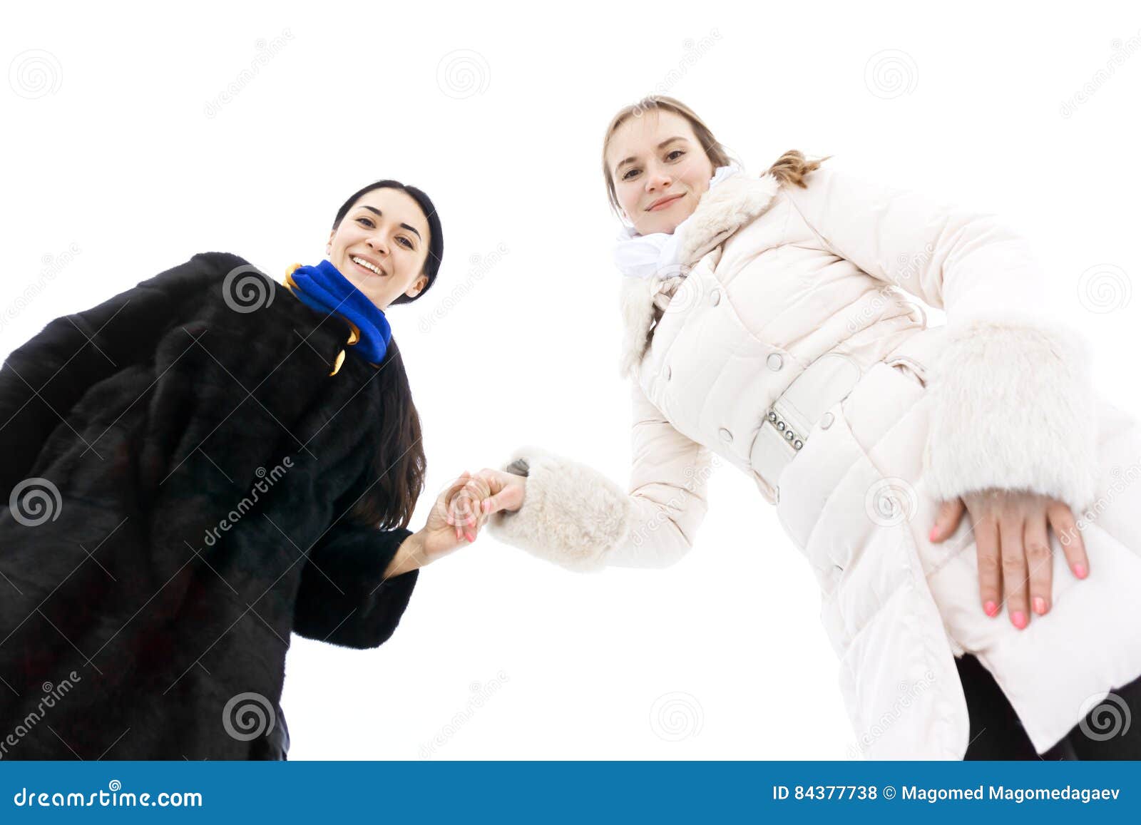 Young women holding hands stock photo. Image of women - 84377738