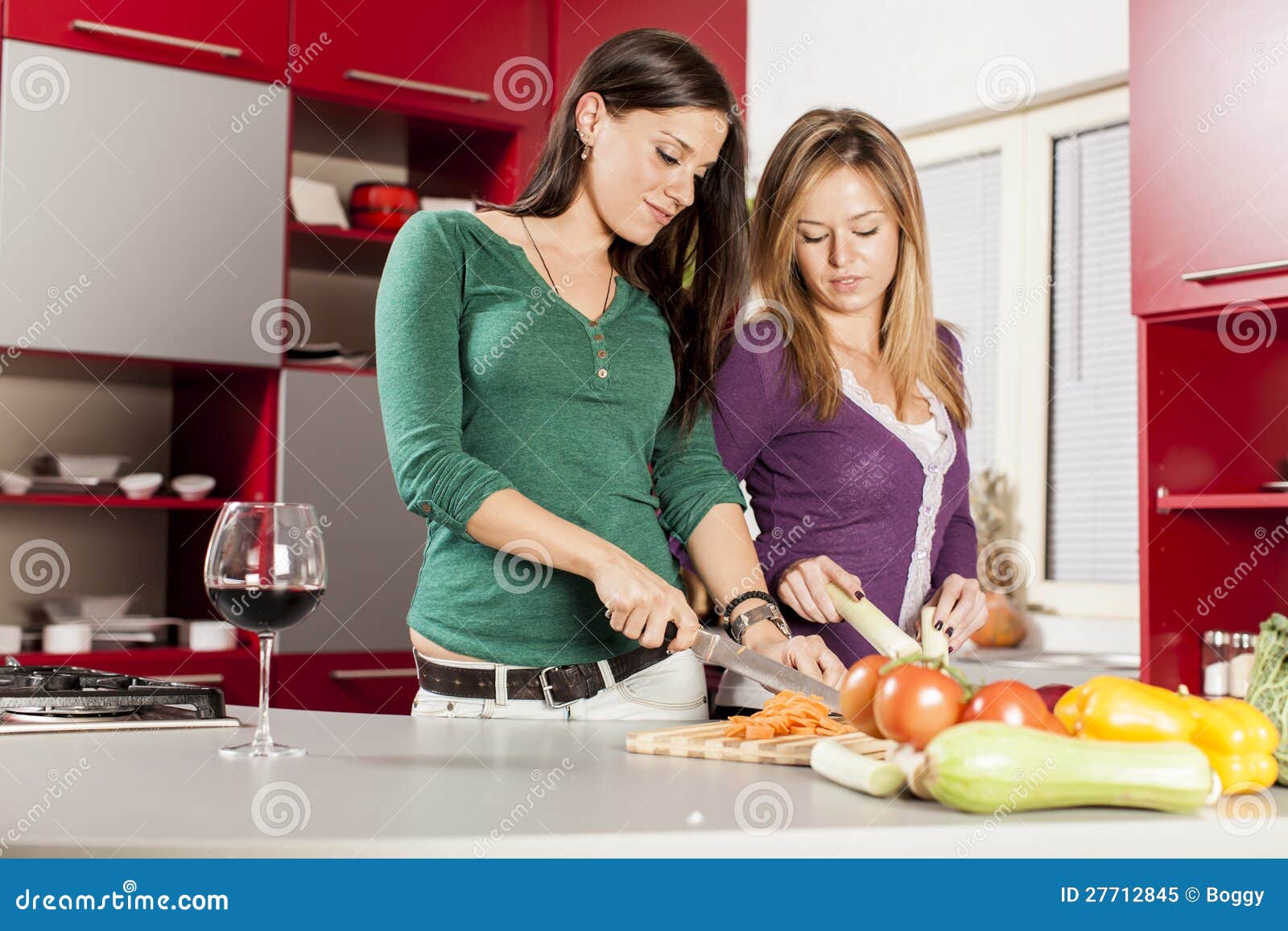 Young women in the kitchen stock image. Image of girl - 27712845