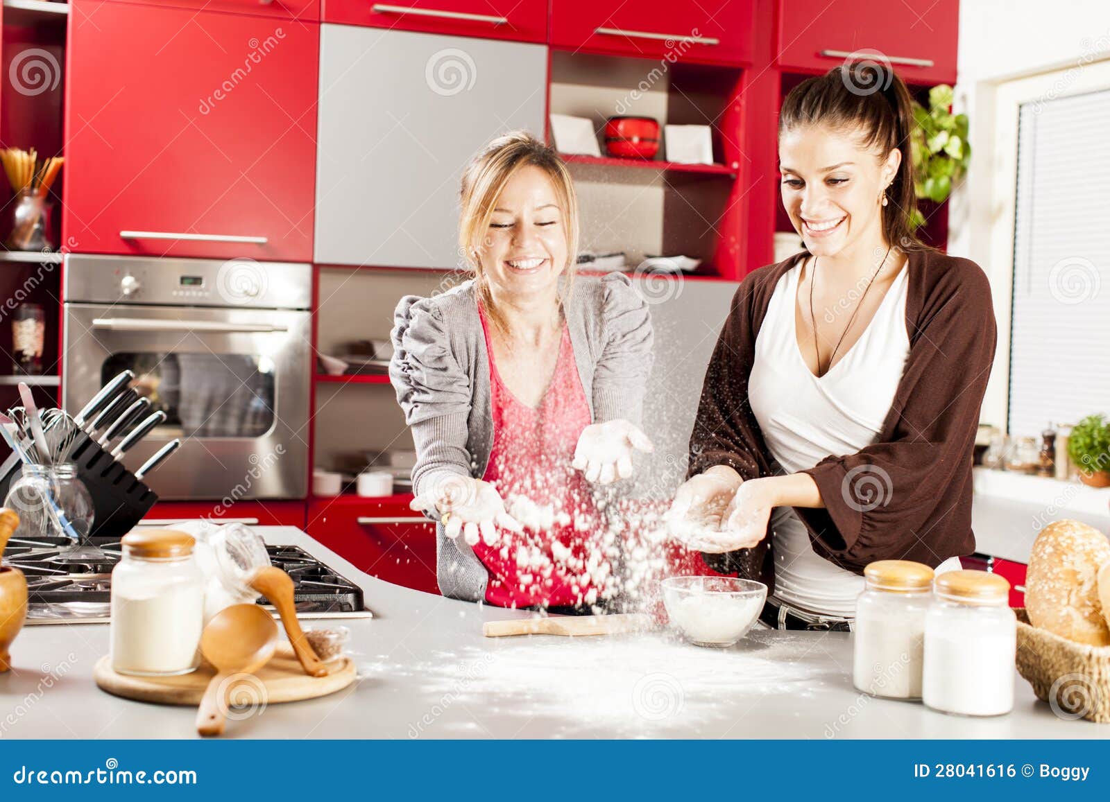 Young women in the kitchen stock photo. Image of enjoying - 28041616