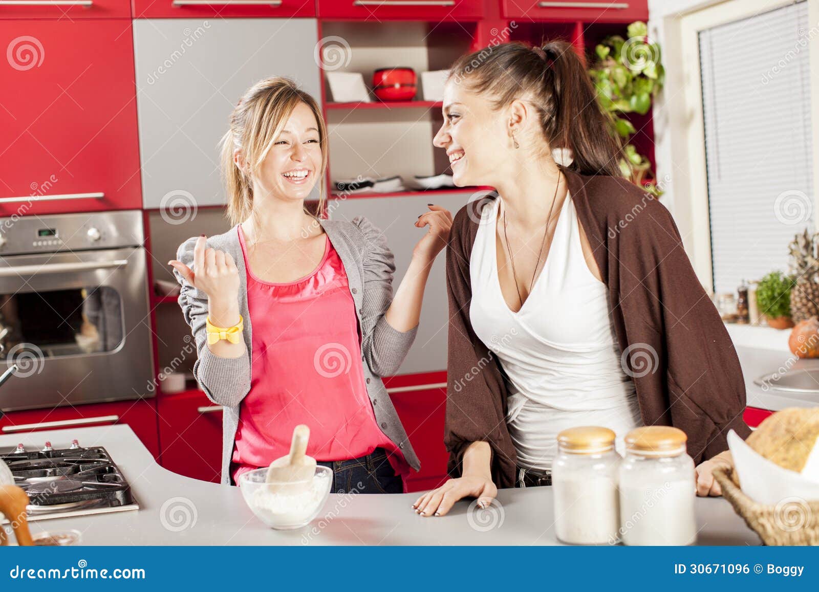Young women in the kitchen stock photo. Image of attractive - 30671096