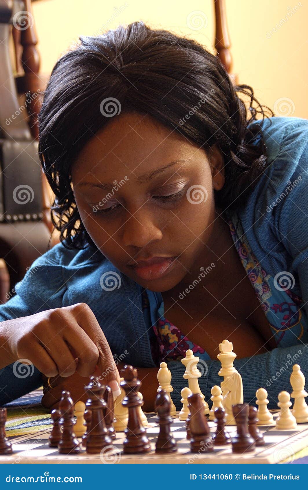 Young women playing chess stock photo. Image of wooden - 13441060