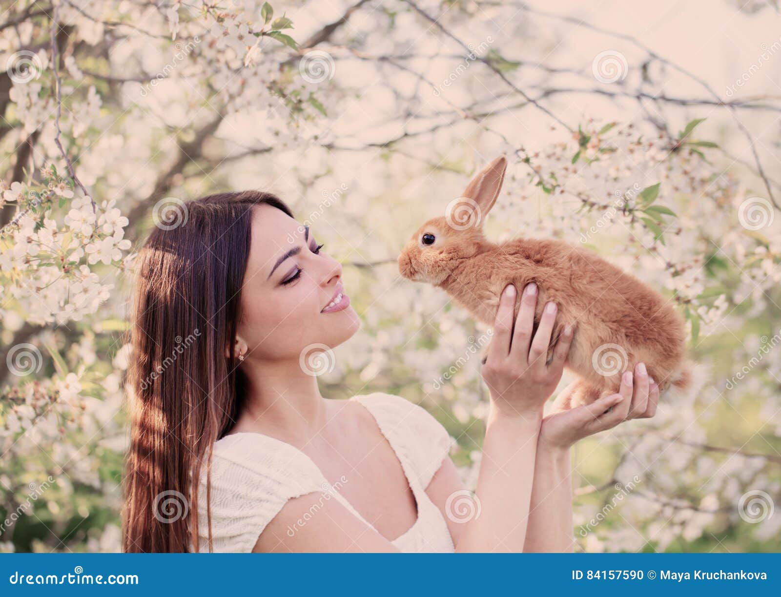 Young women with rabbit stock photo. Image of natural - 84157590
