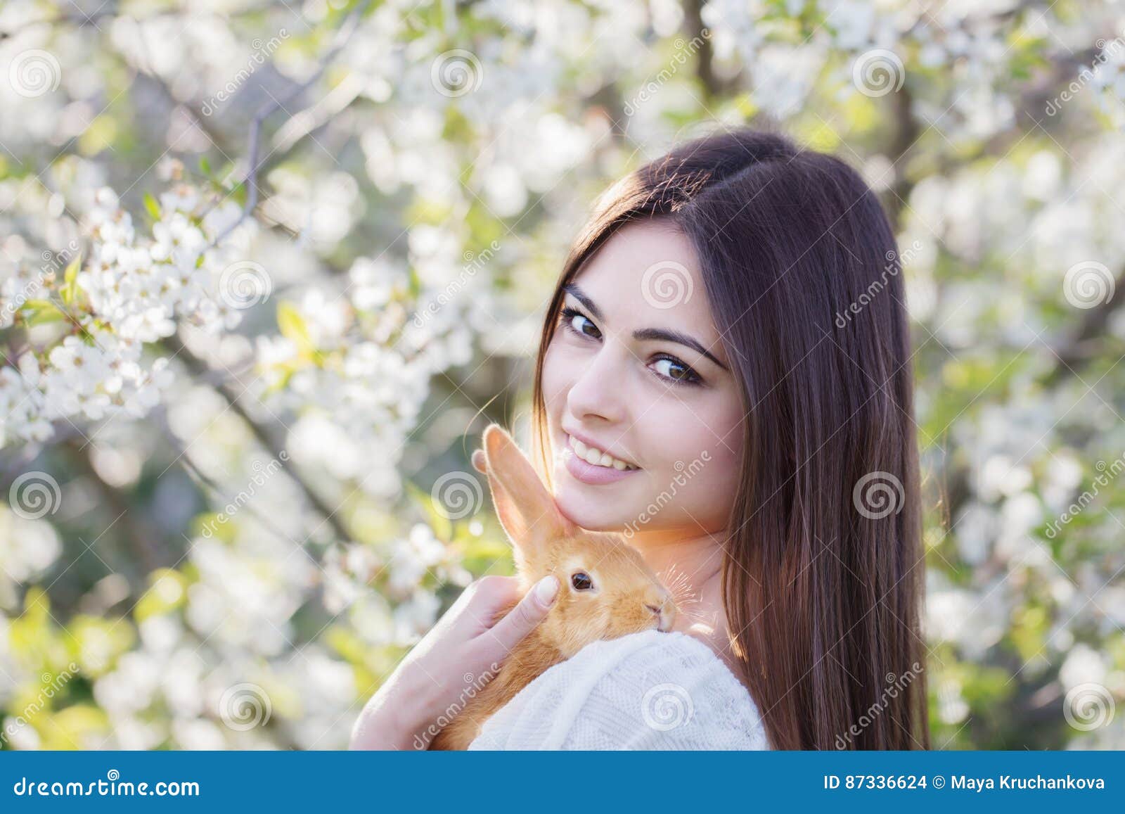 Young women with rabbit stock photo. Image of outdoor - 87336624