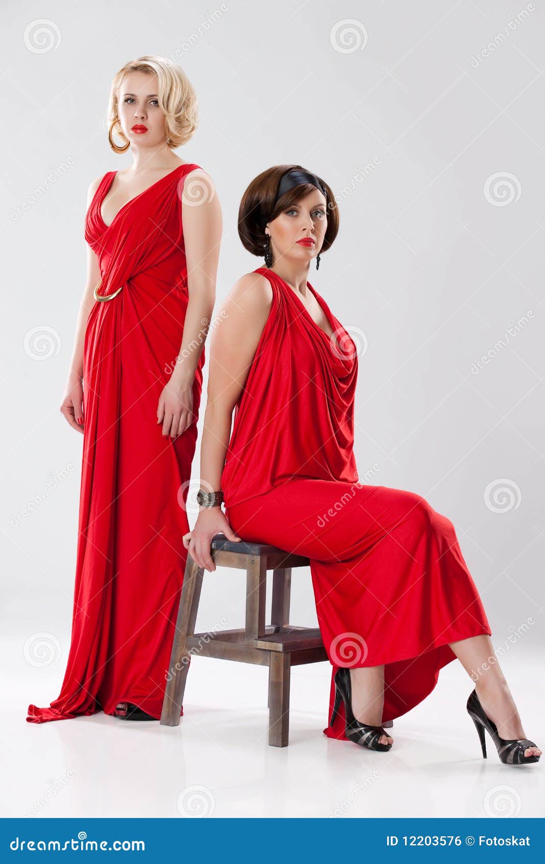 Young Women in Red Dresses stock photo. Image of isolated - 12203576