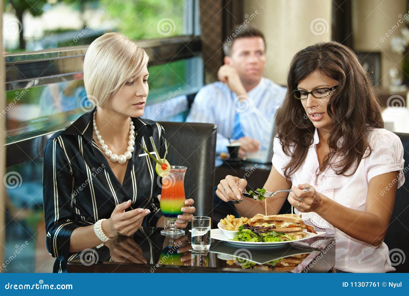 Young women in restaurant stock image. Image of casual - 11307761