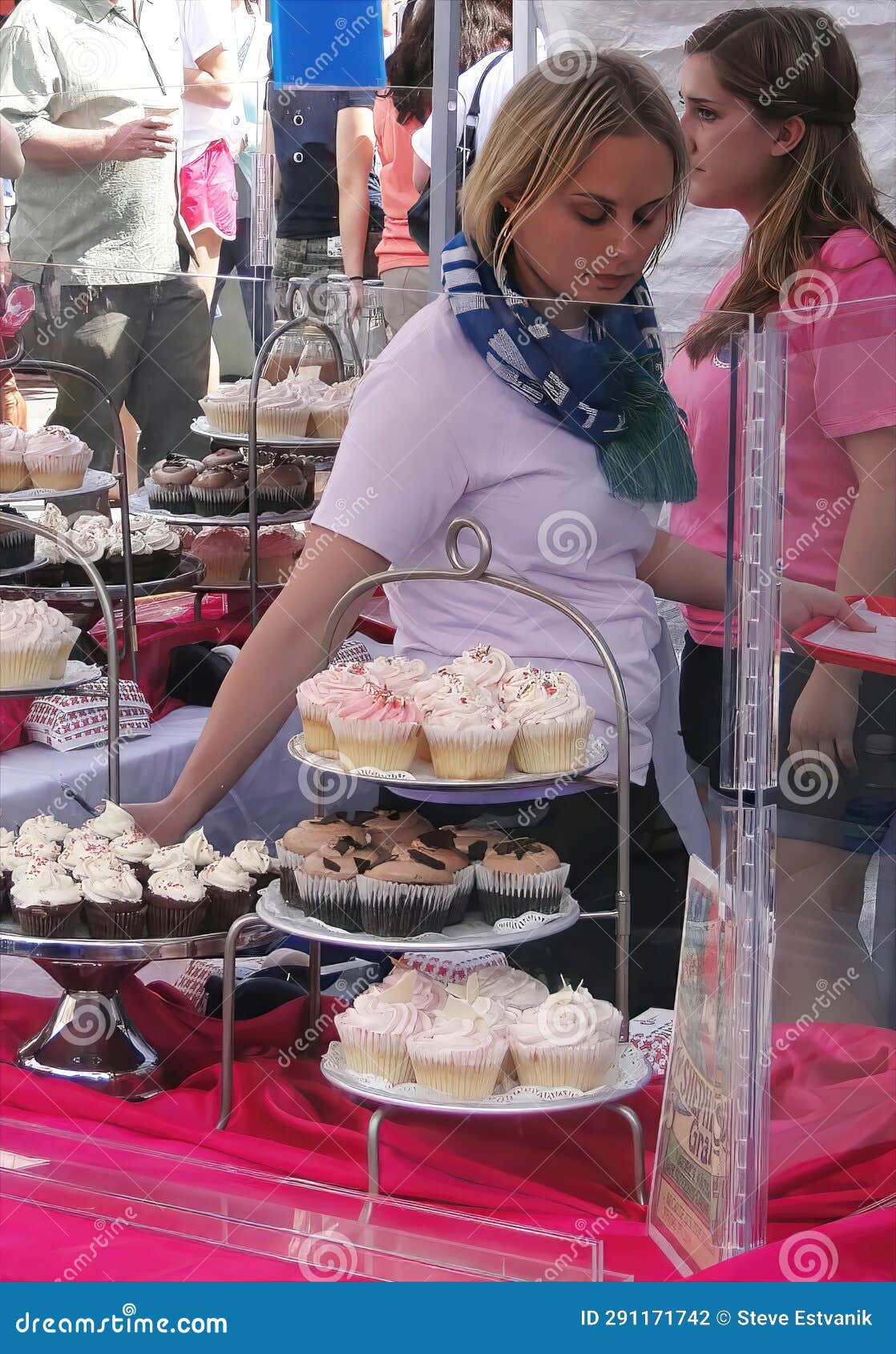 Young women sell cupcakes editorial photography. Image of booth - 291171742