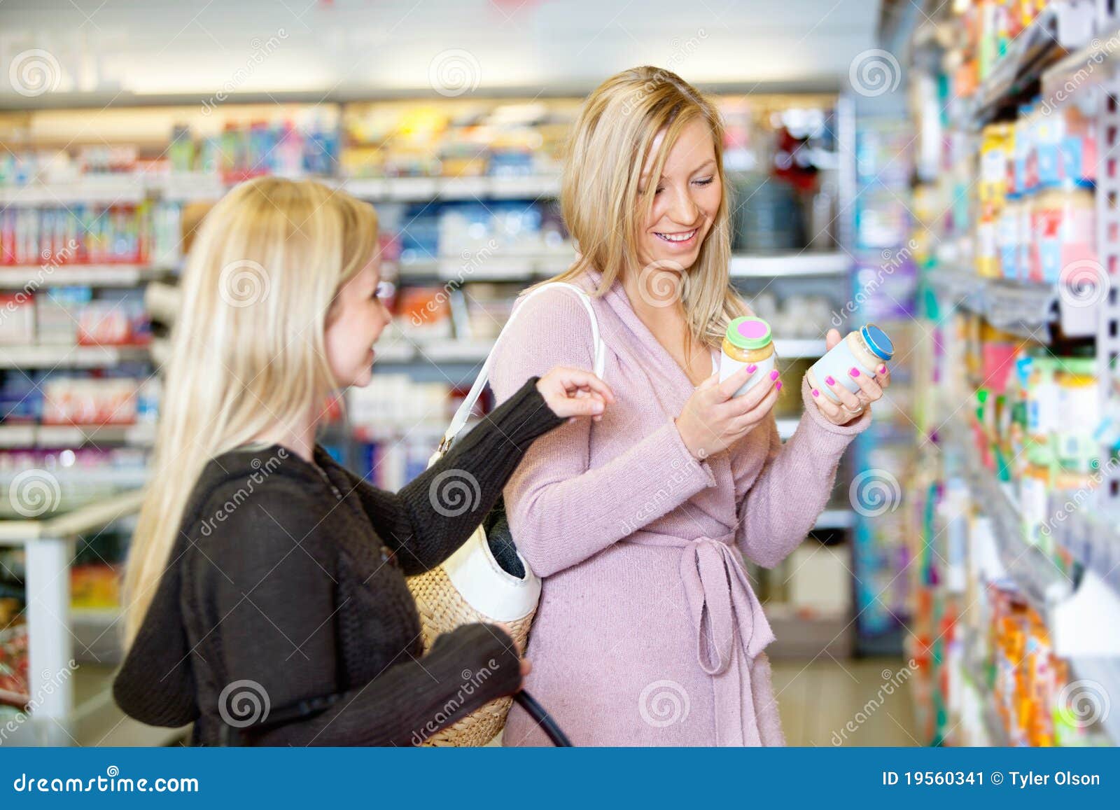 Young Women Smiling while Shopping Together Stock Image - Image of ...