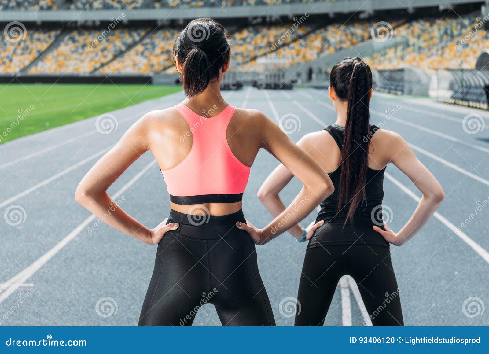 Women Sprinters At Starting Position Ready For Race On Racetrack