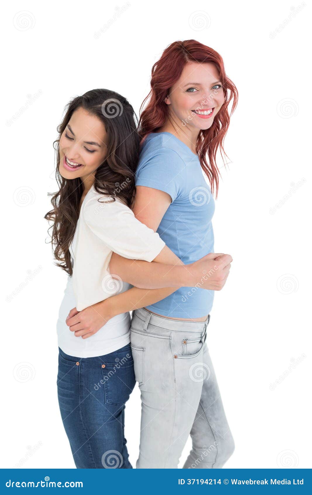 Young Women Standing Back To Back with Interlocked Hands Stock Photo ...