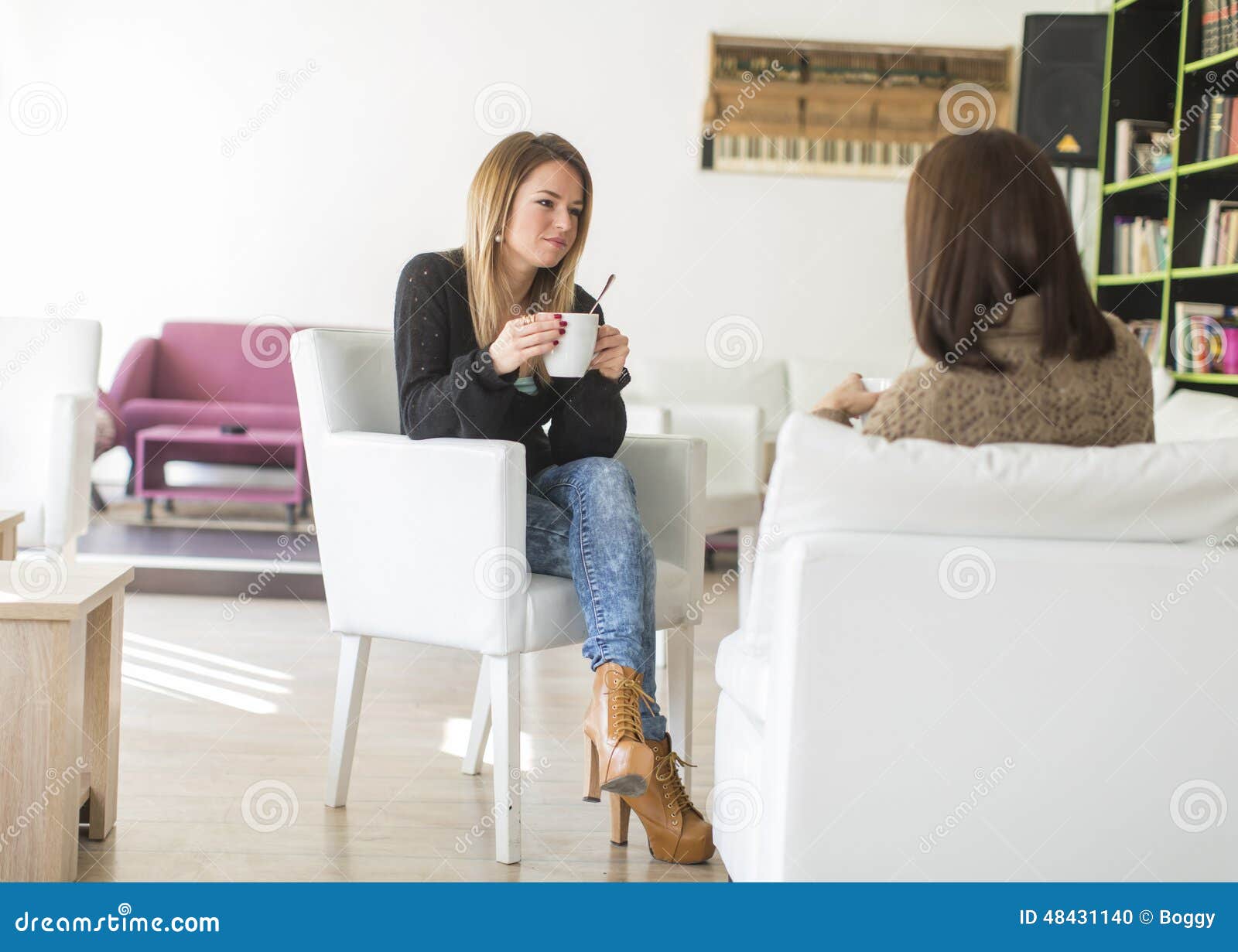 Young Women Talking and Drinking Tea Stock Photo - Image of attractive ...
