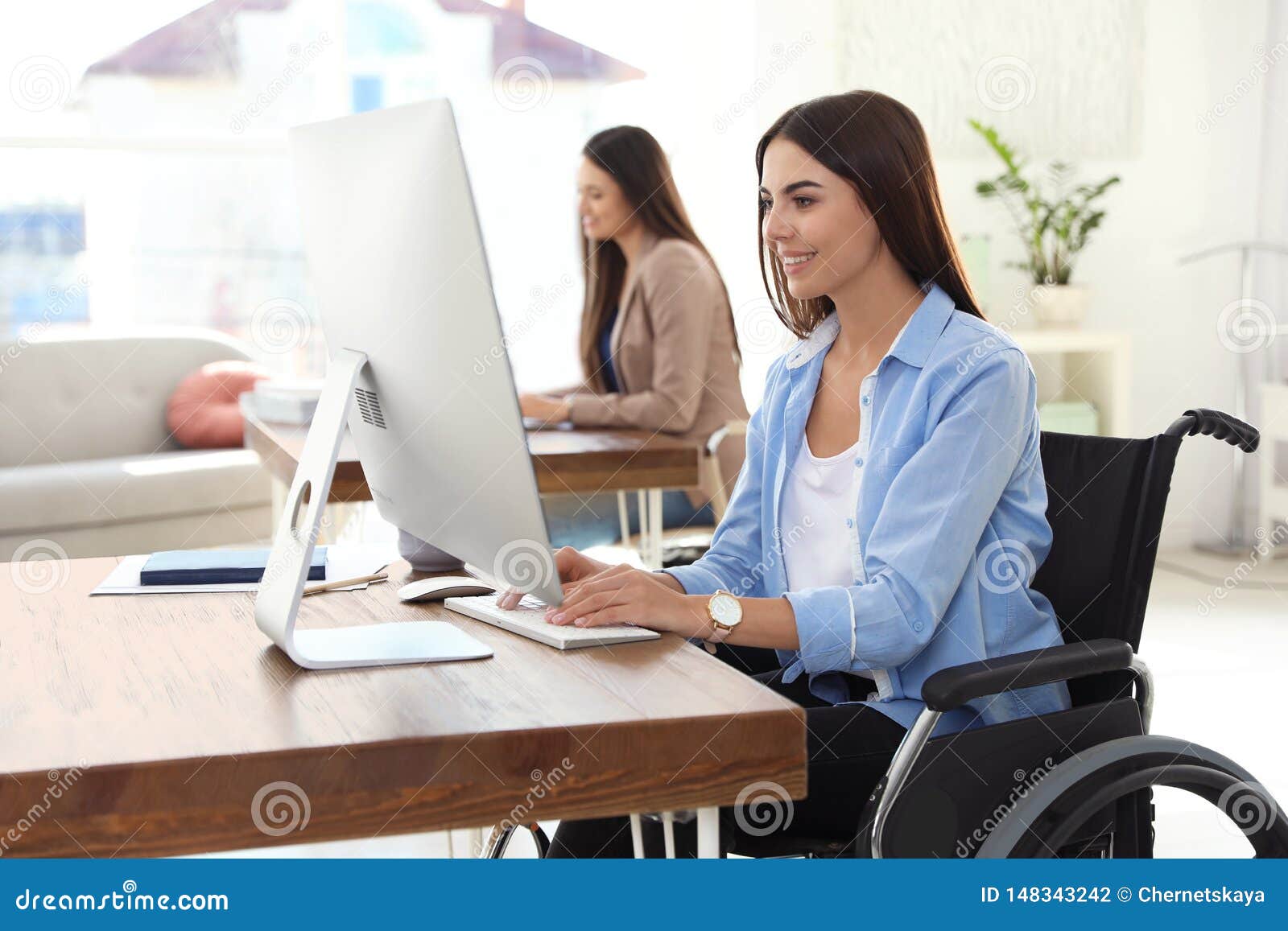Young Woman in Wheelchair Using Computer Stock Photo - Image of ...