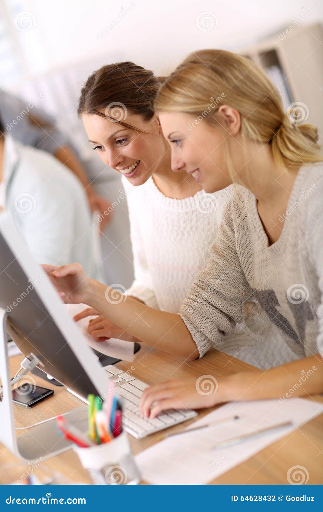 Young Women Working on Desktop Computer Stock Photo - Image of group ...