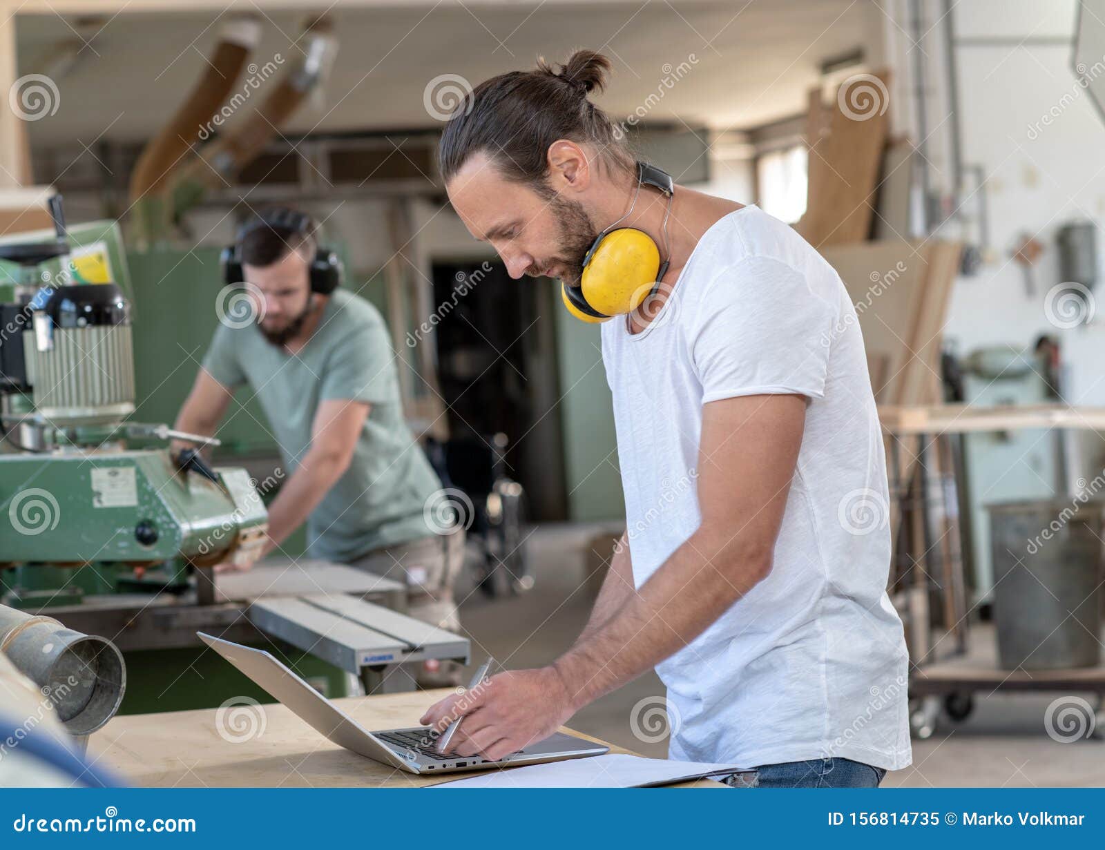 Young Worker in a Carpenter`s Workshop Using Milling Machine Stock ...