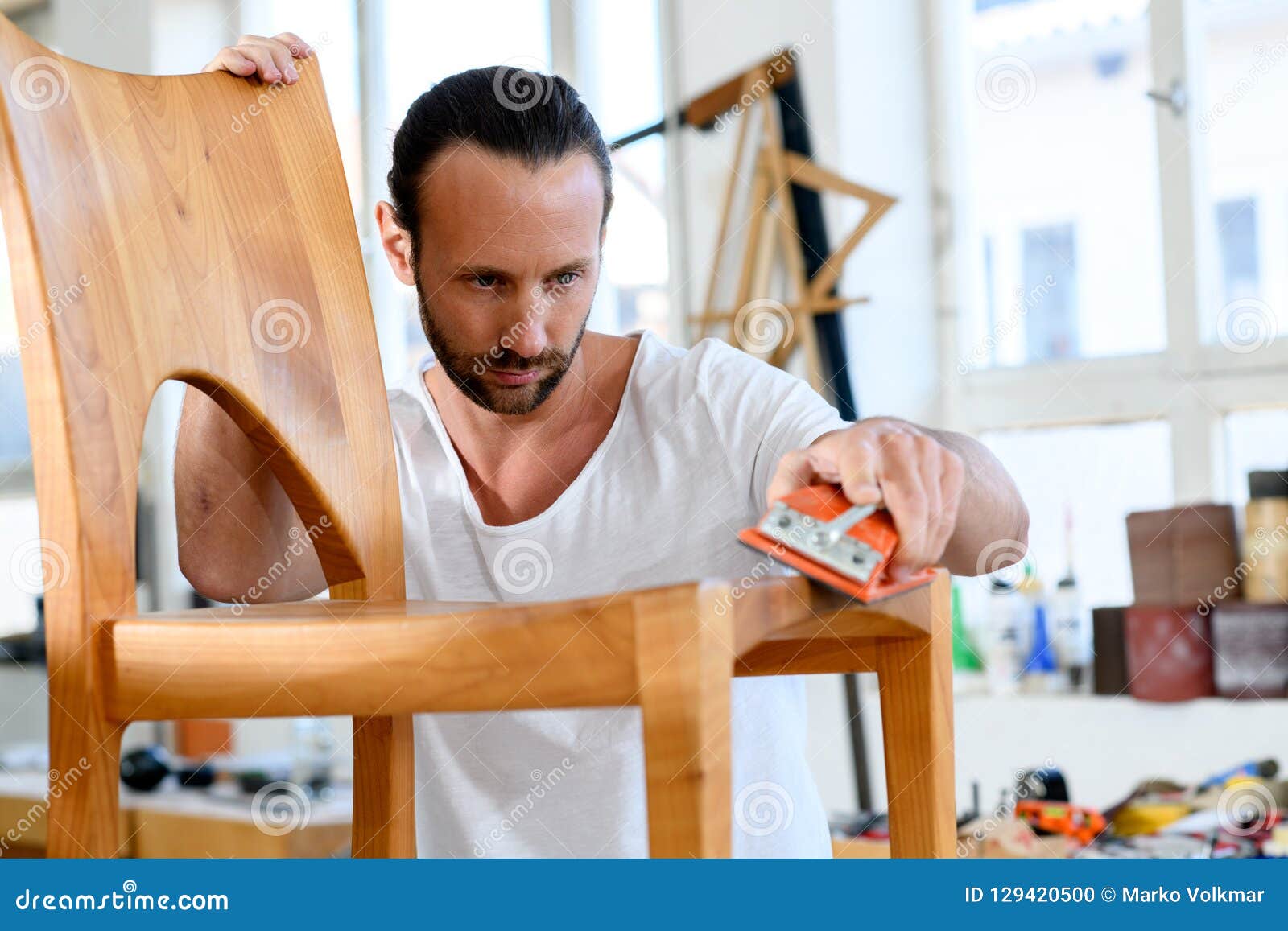 Young Worker in a Carpenters Workshop with Wooden Chair Stock Photo ...
