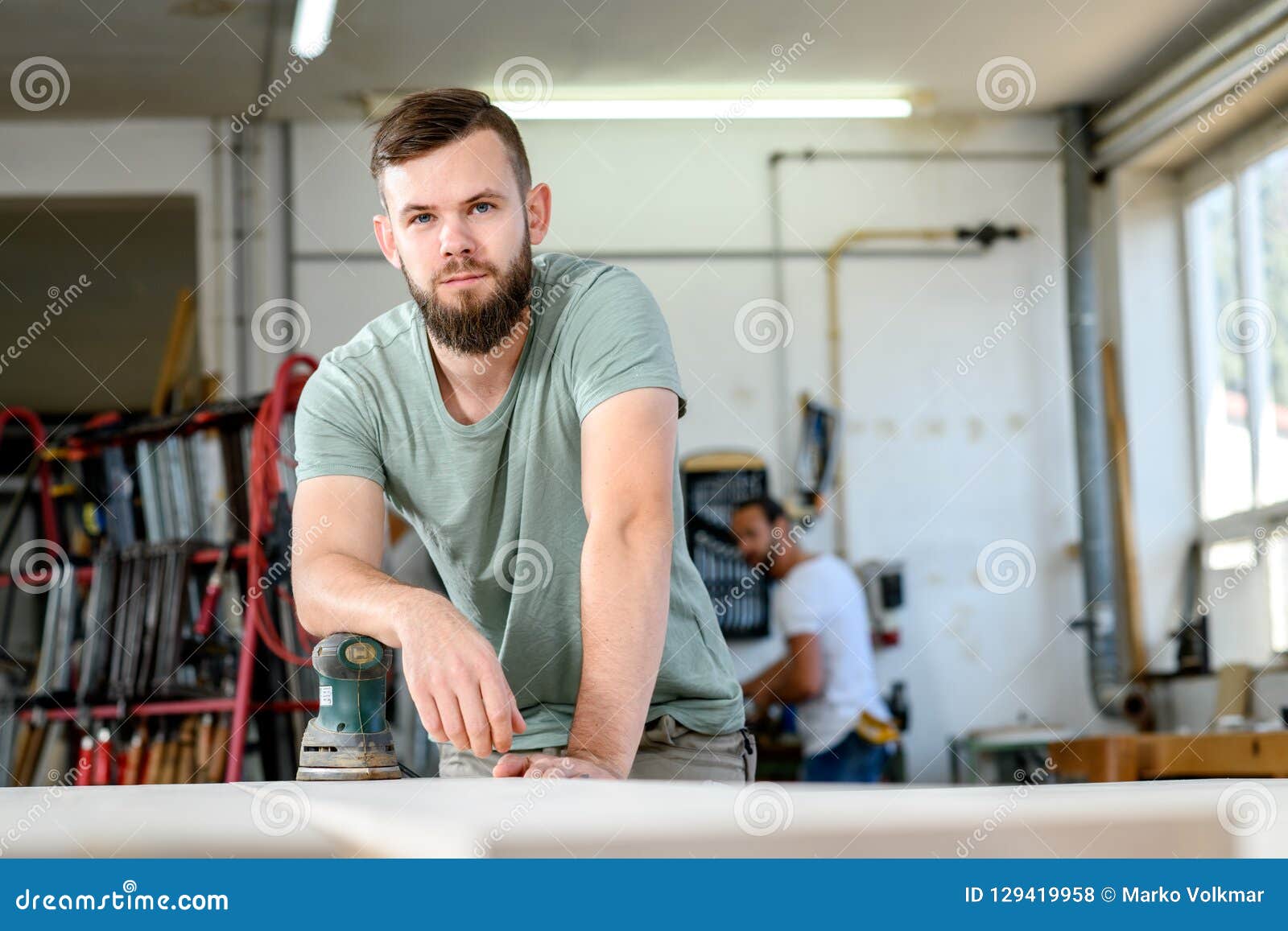 Young Worker in a Carpenters Workshop Stock Photo - Image of machine ...