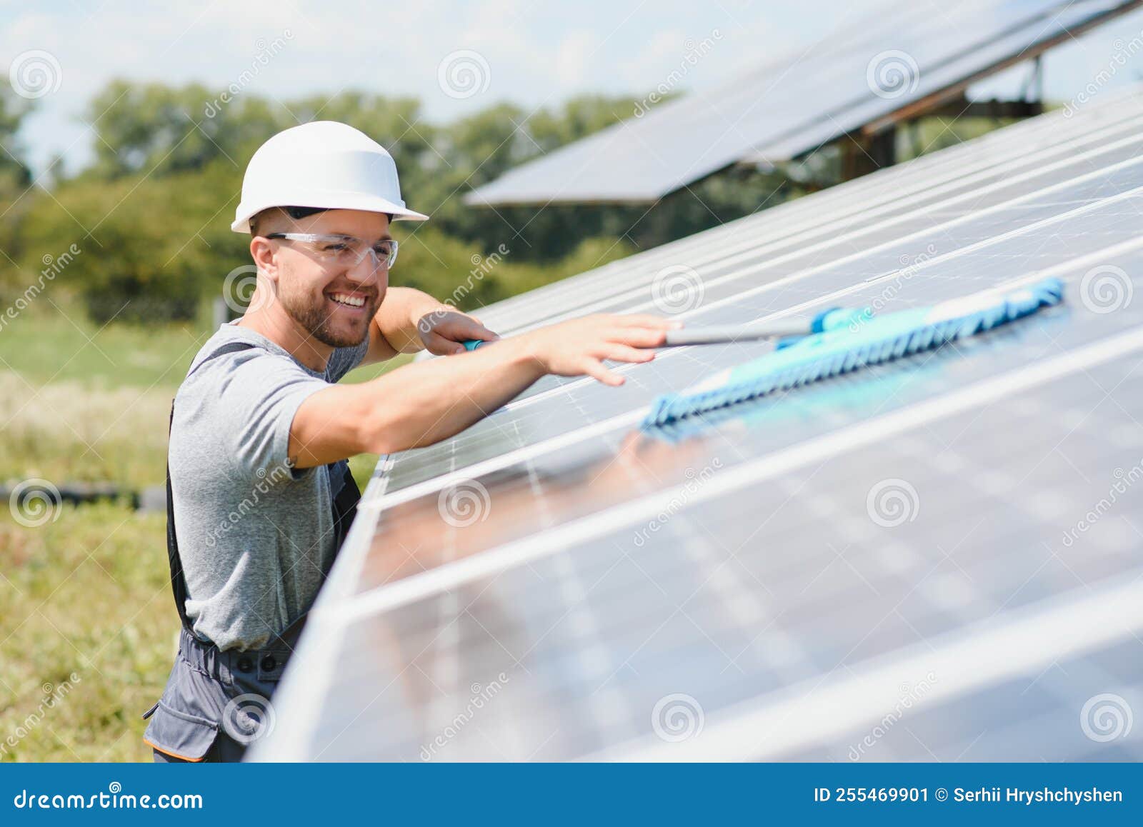 Young Worker Cleaning Solar Panels. Stock Image - Image of business ...