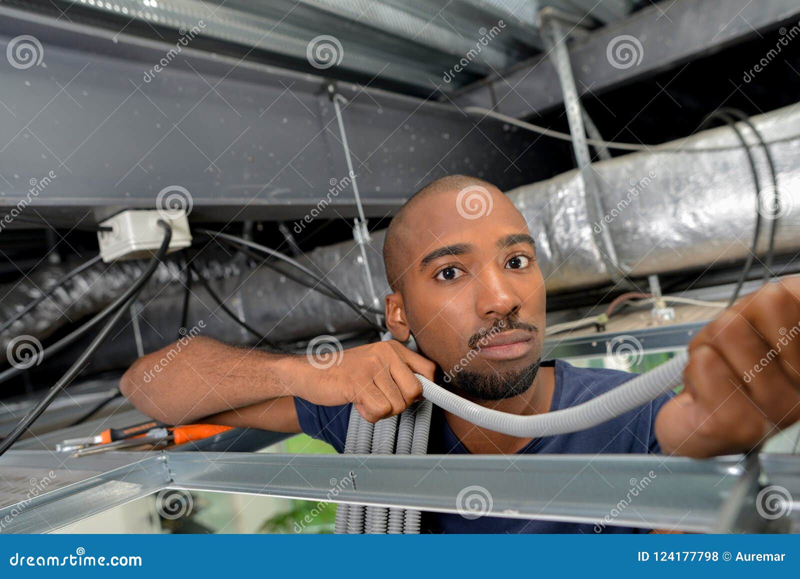 Young Worker Connecting Wires Stock Photo - Image of beard, wiring ...