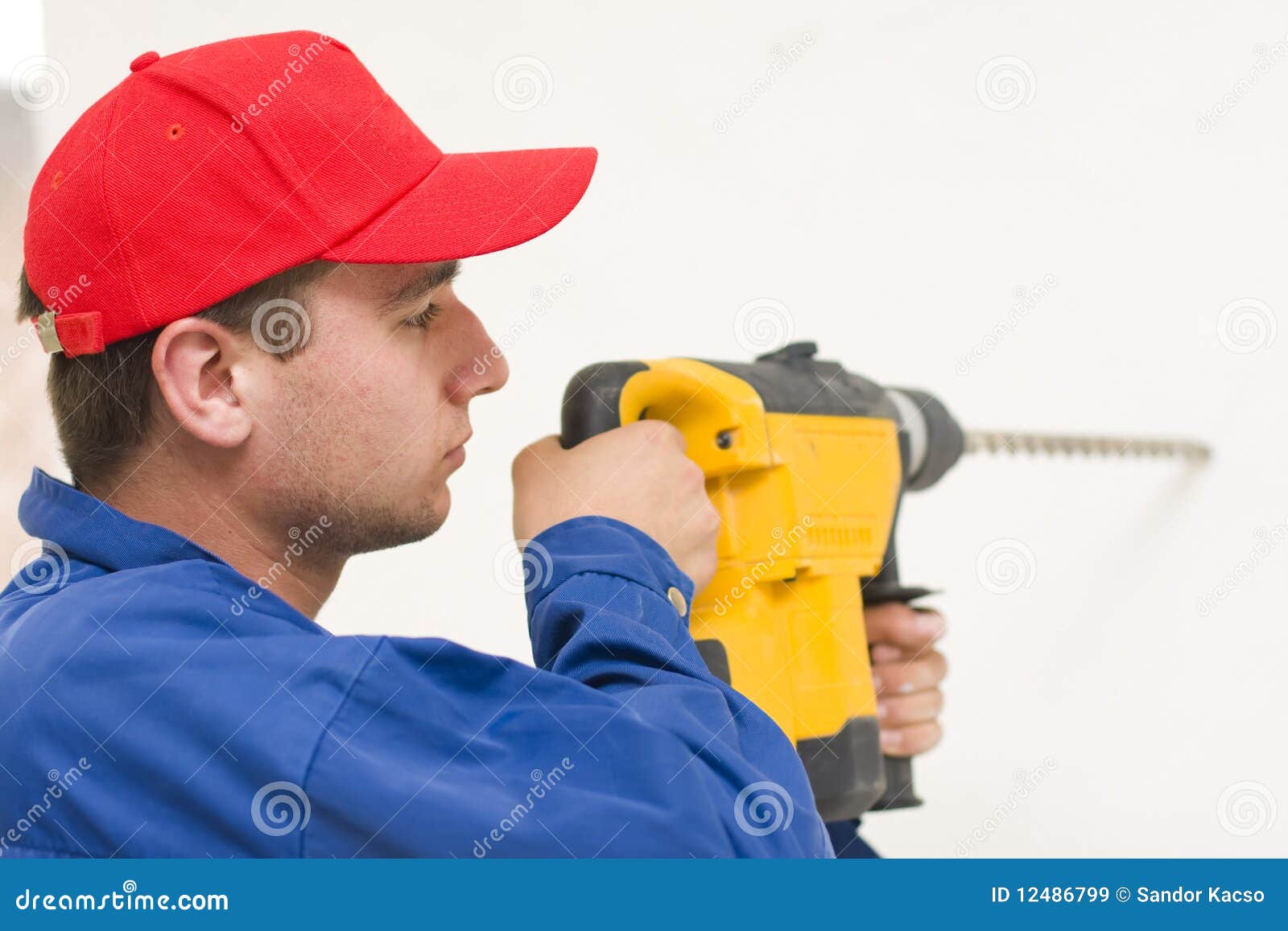 Young worker drilling stock image. Image of construction - 12486799