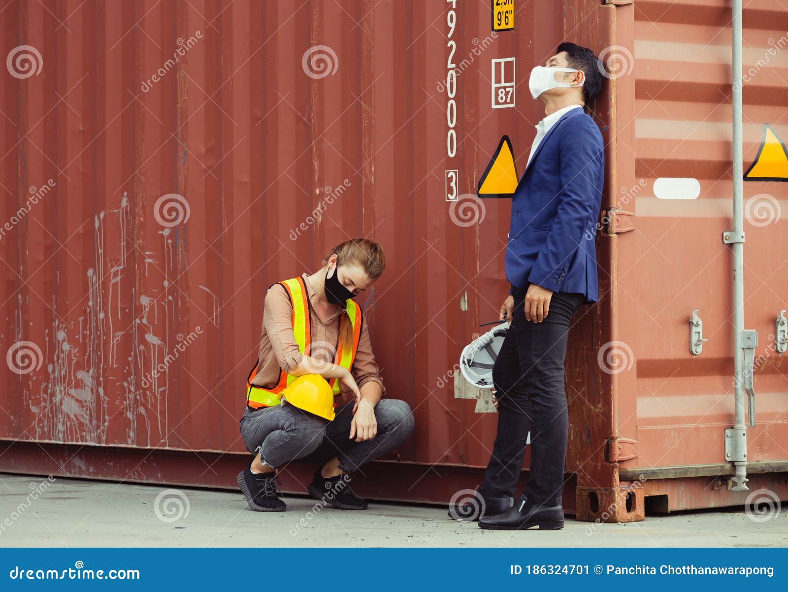 Young Worker and Engineer Sitting Failed and Stressed at Cargo ...