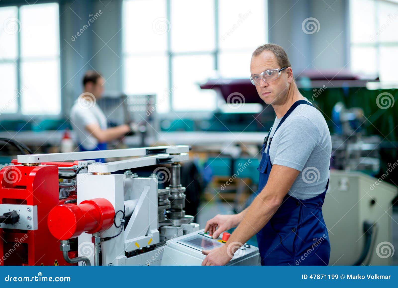 Young worker in factory stock image. Image of business - 47871199