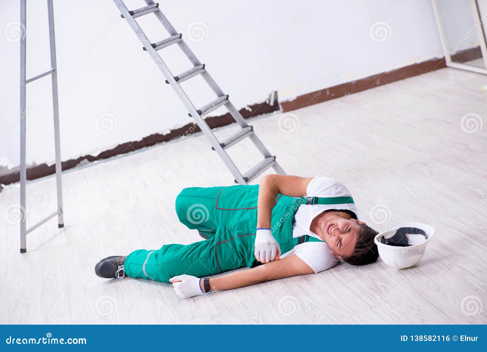The Young Worker Falling from the Ladder Stock Photo - Image of floor ...