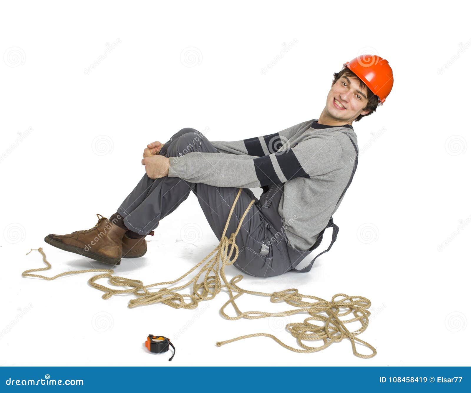 A Young Worker in Grey Uniform Tied Up with Rope on White Isolated ...