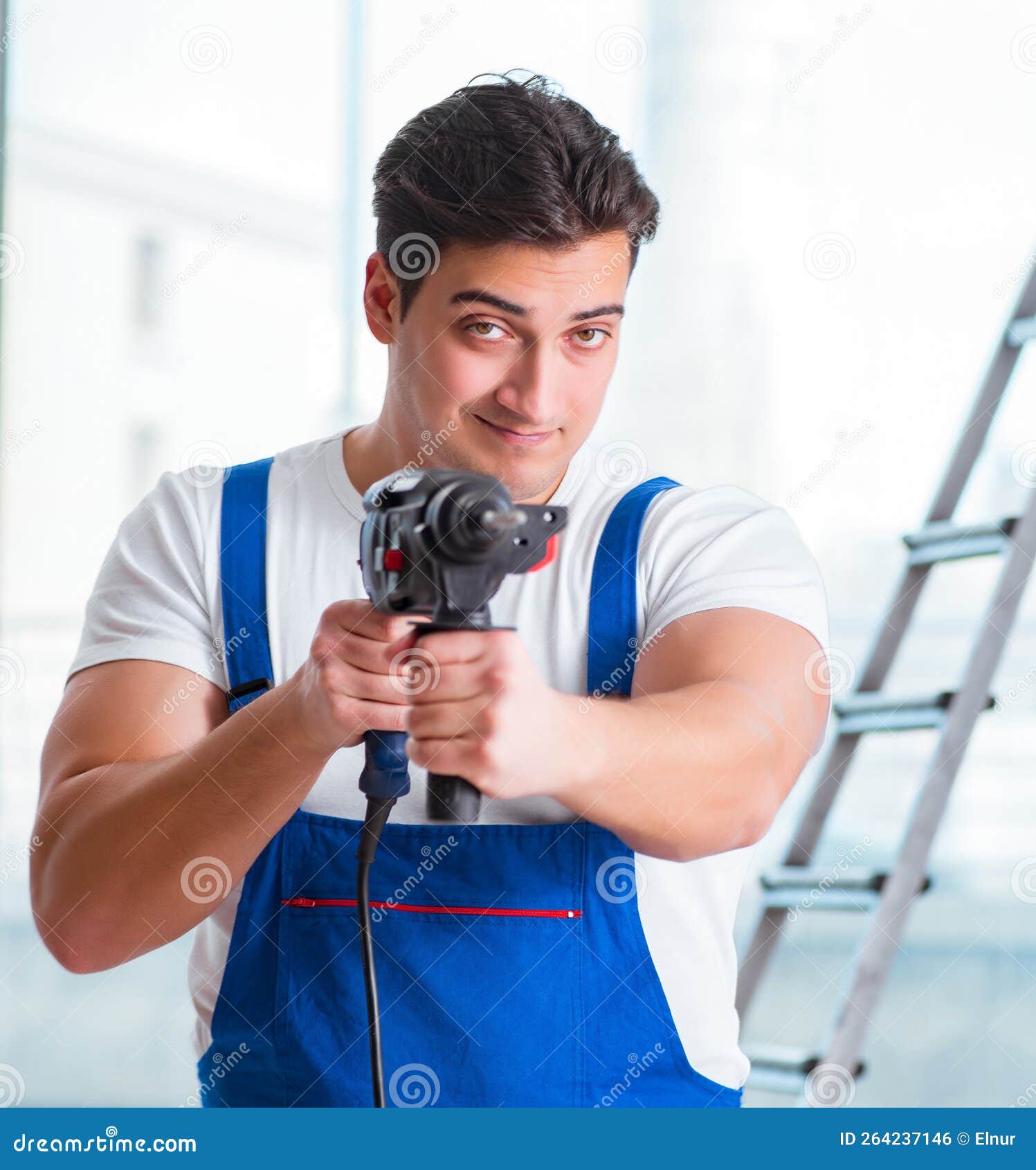Young Worker with Hand Drill Stock Photo - Image of drill, home: 264237146