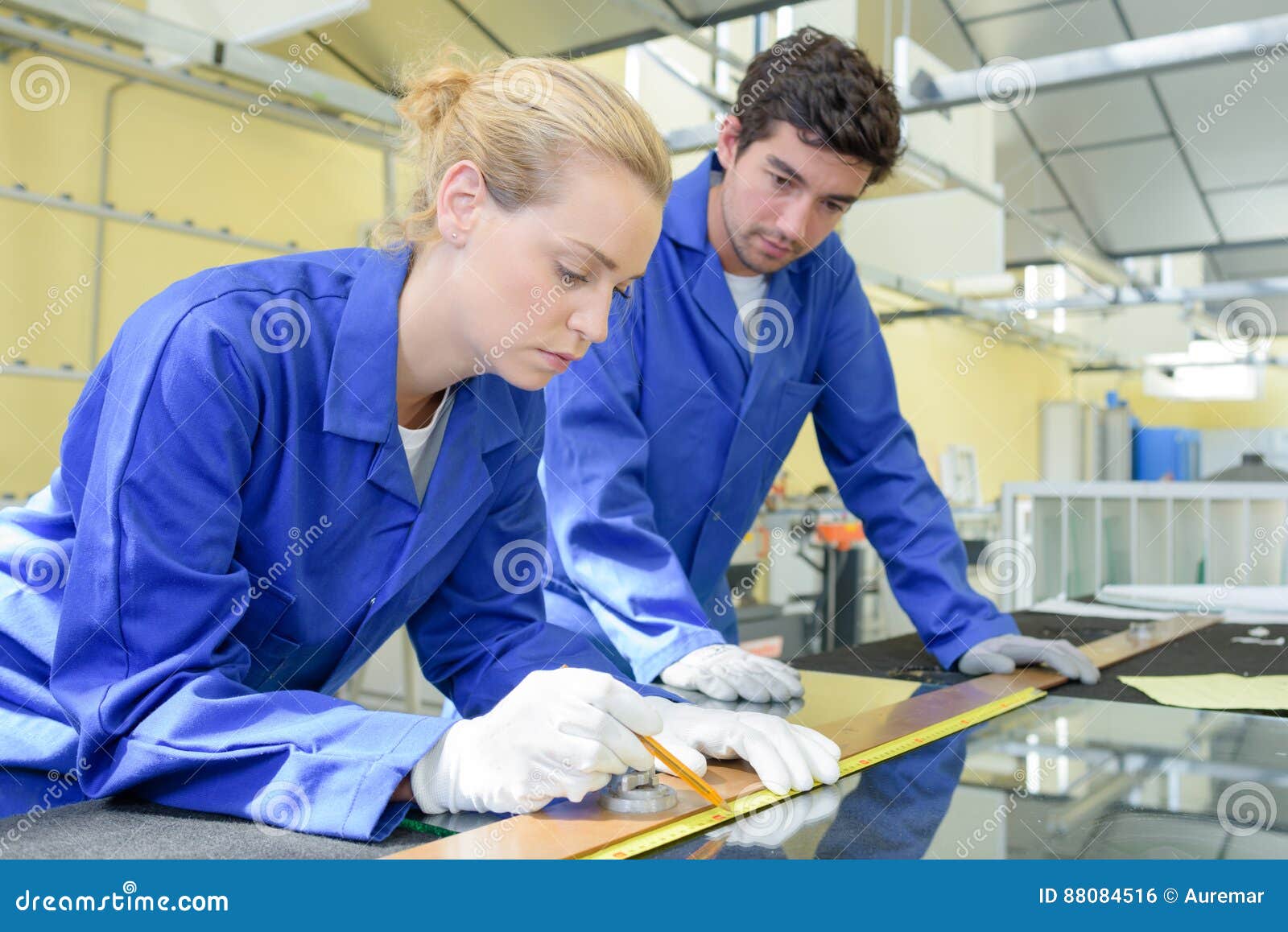 Young Worker Measuring Length Strip Stock Photo - Image of industry ...