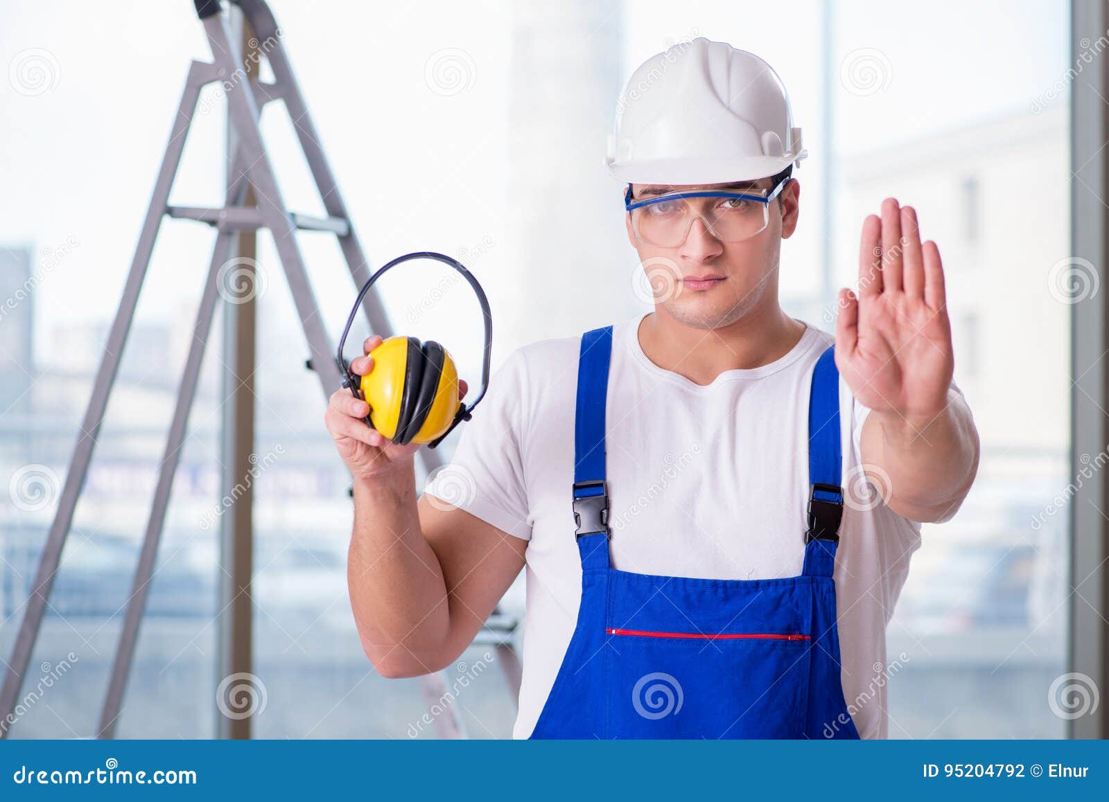 The Young Worker with Noise Cancelling Headphones Stock Photo - Image ...