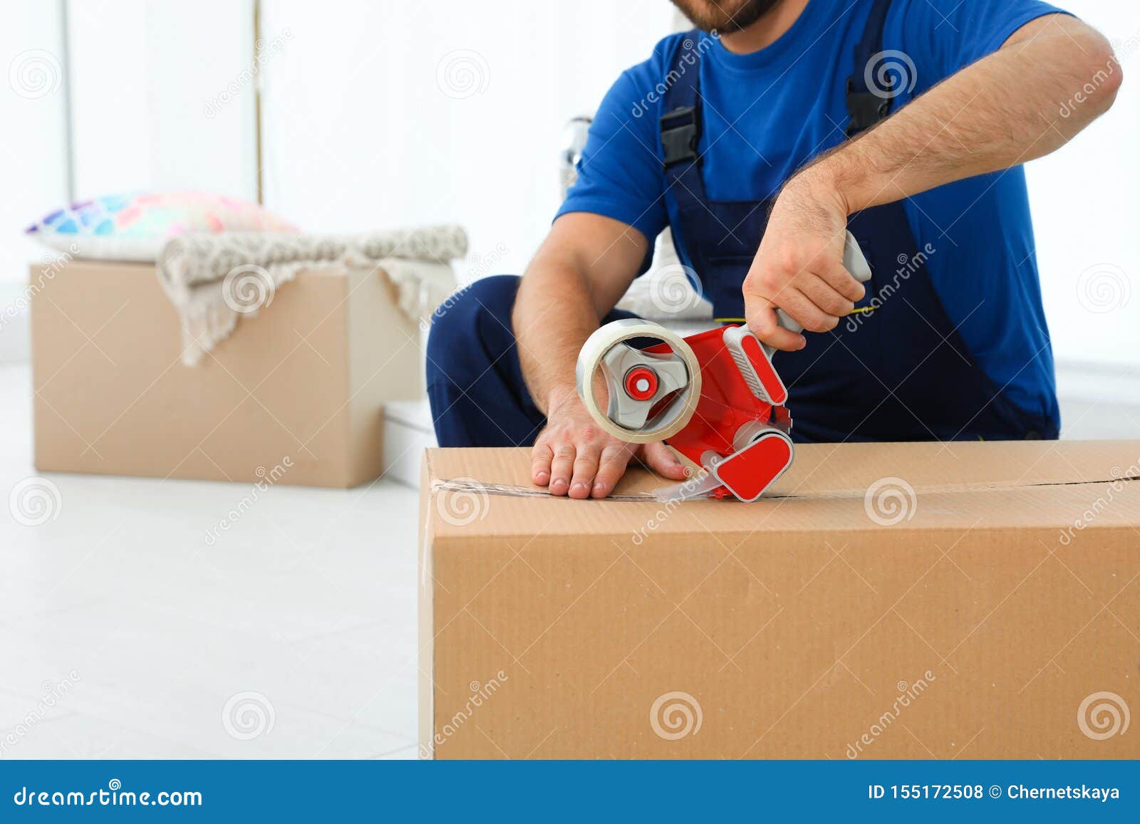 Young Worker Packing Box in Room, Closeup Stock Photo - Image of ...