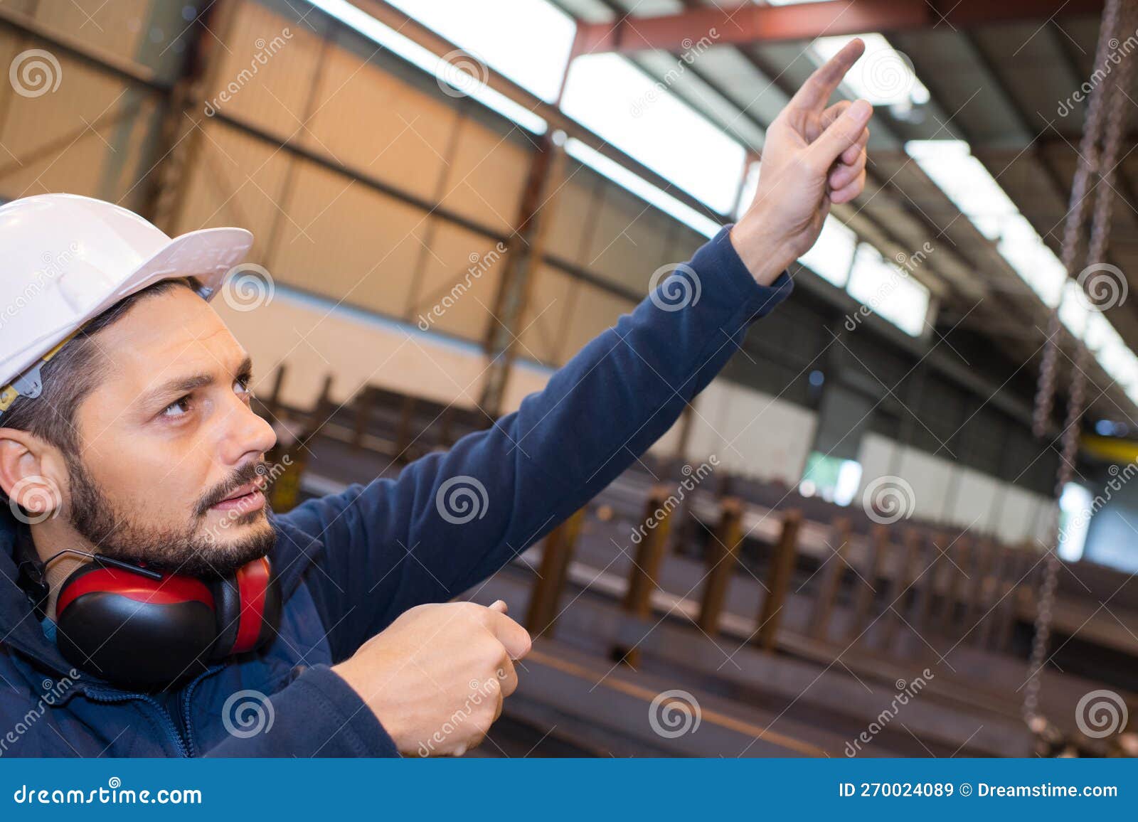 Young Worker Pointing in Factory Stock Image - Image of factory ...