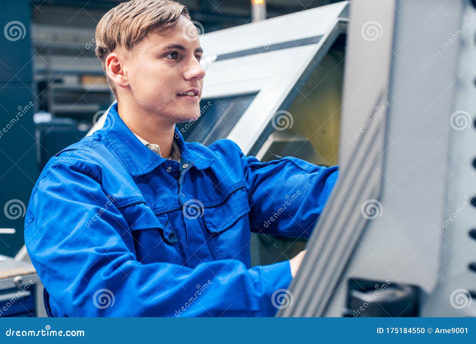 Young Worker Programming Lathe Machine in Factory Stock Photo - Image ...