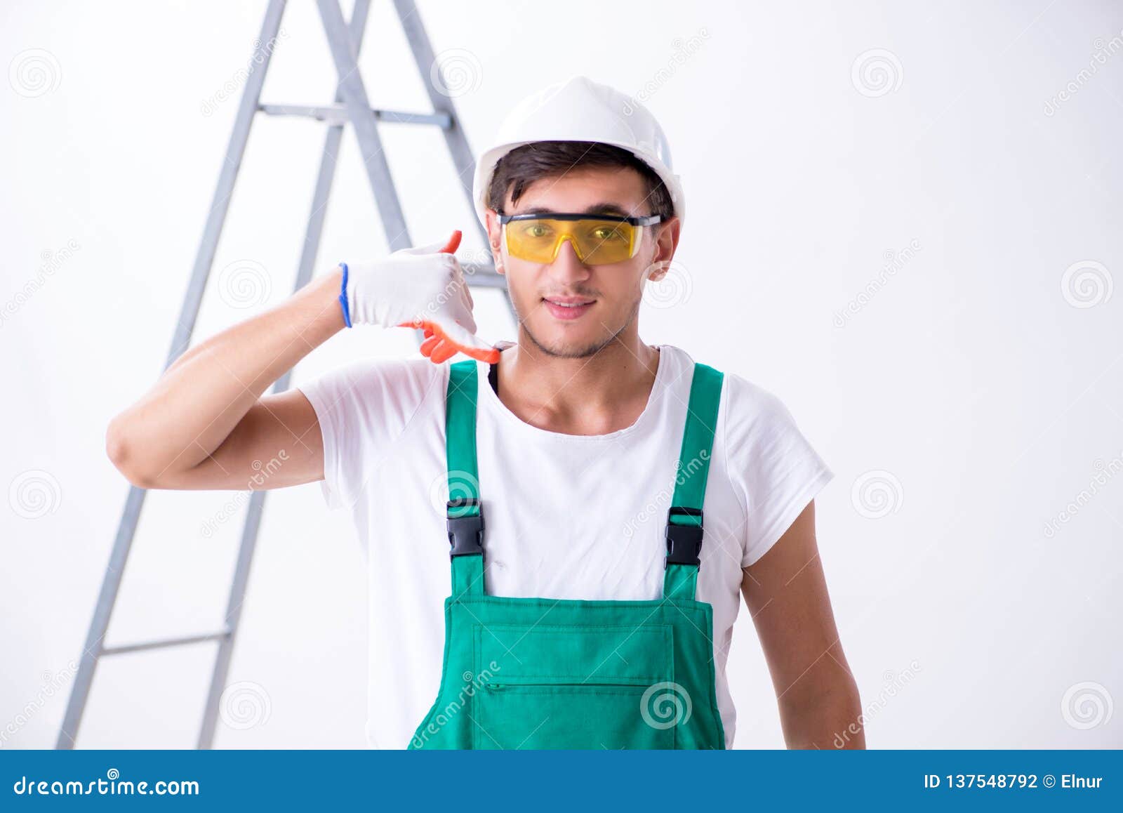 The Young Worker with Protective Equipment in Safety Concept Stock ...