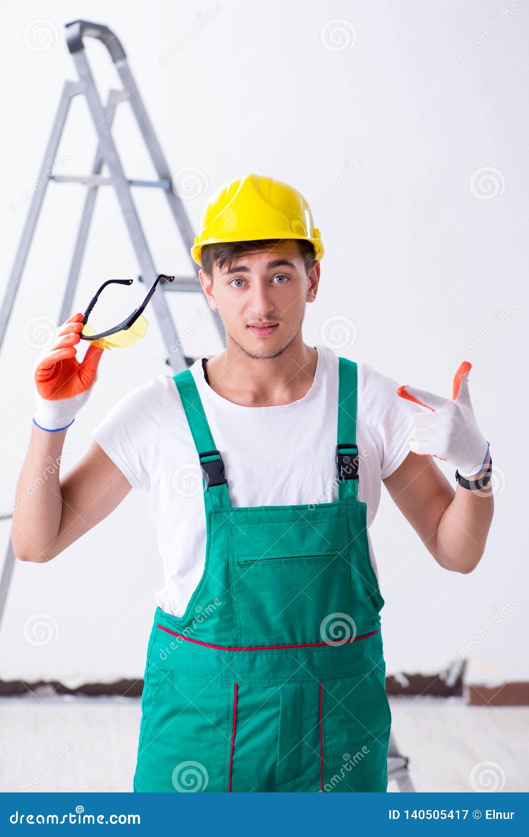 The Young Worker with Protective Equipment in Safety Concept Stock ...