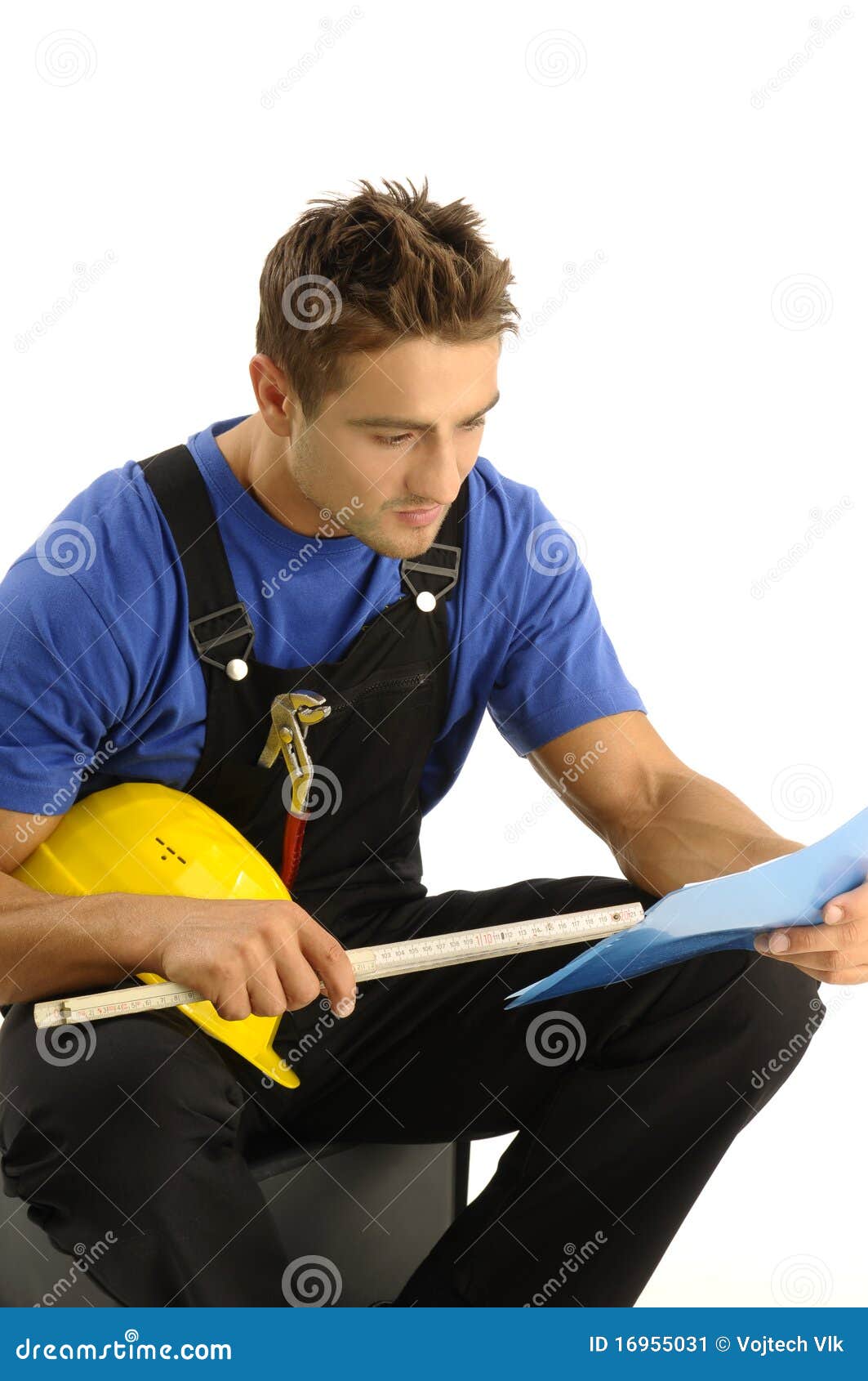 Young Worker Reading Instructions Stock Image - Image of black ...