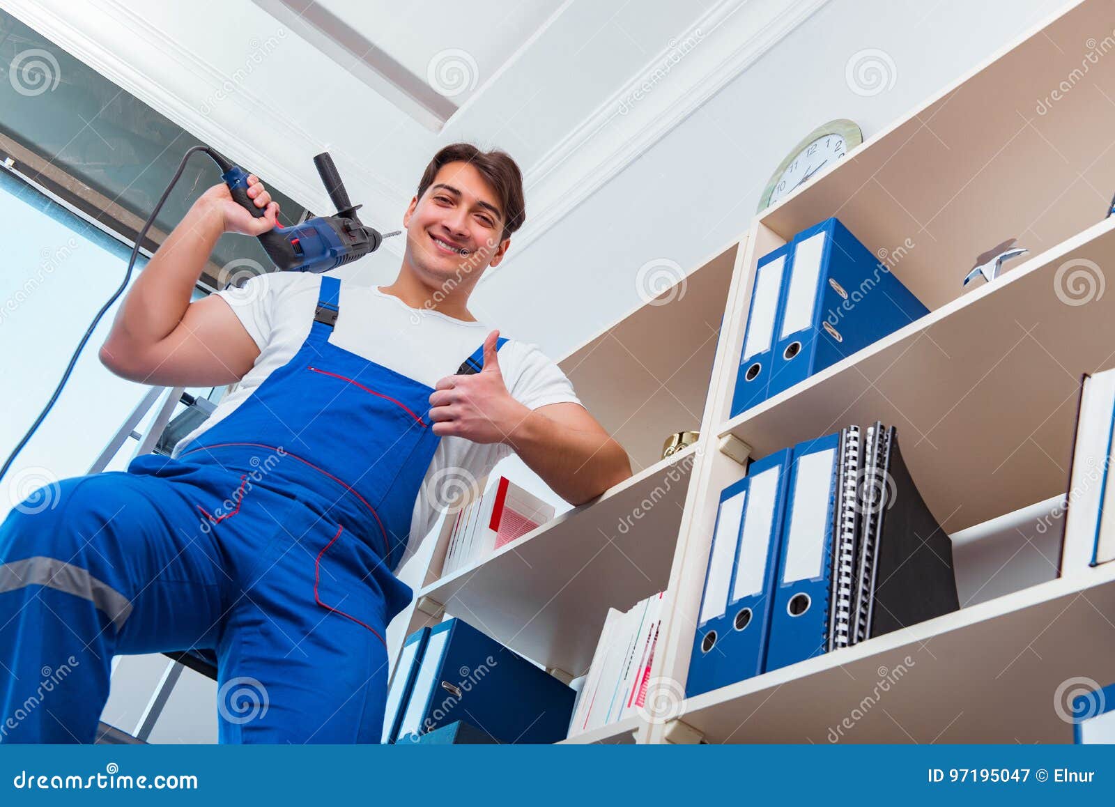 The Young Worker Repairing Shelves in Office Stock Image - Image of ...
