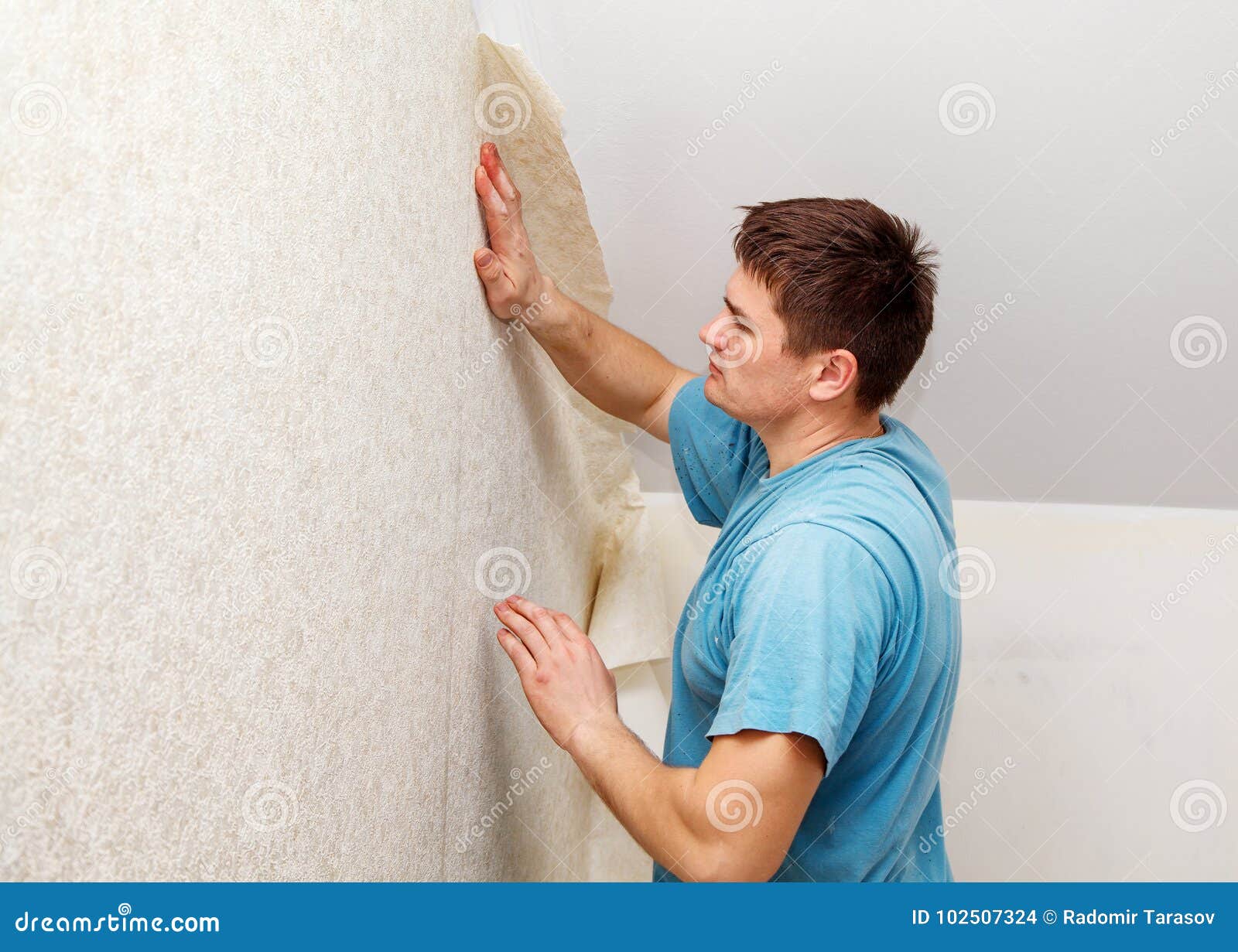 Young Worker Smoothing Wallpaper Stock Photo - Image of construction ...