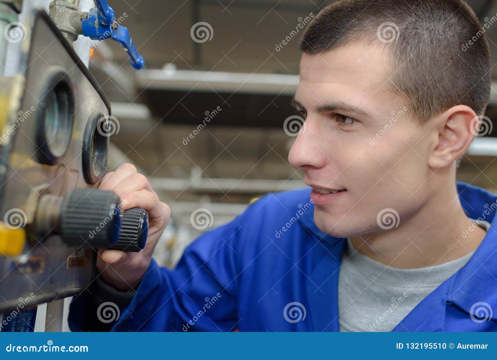 Young Worker Turning Dial on Machinery Stock Photo - Image of touch ...
